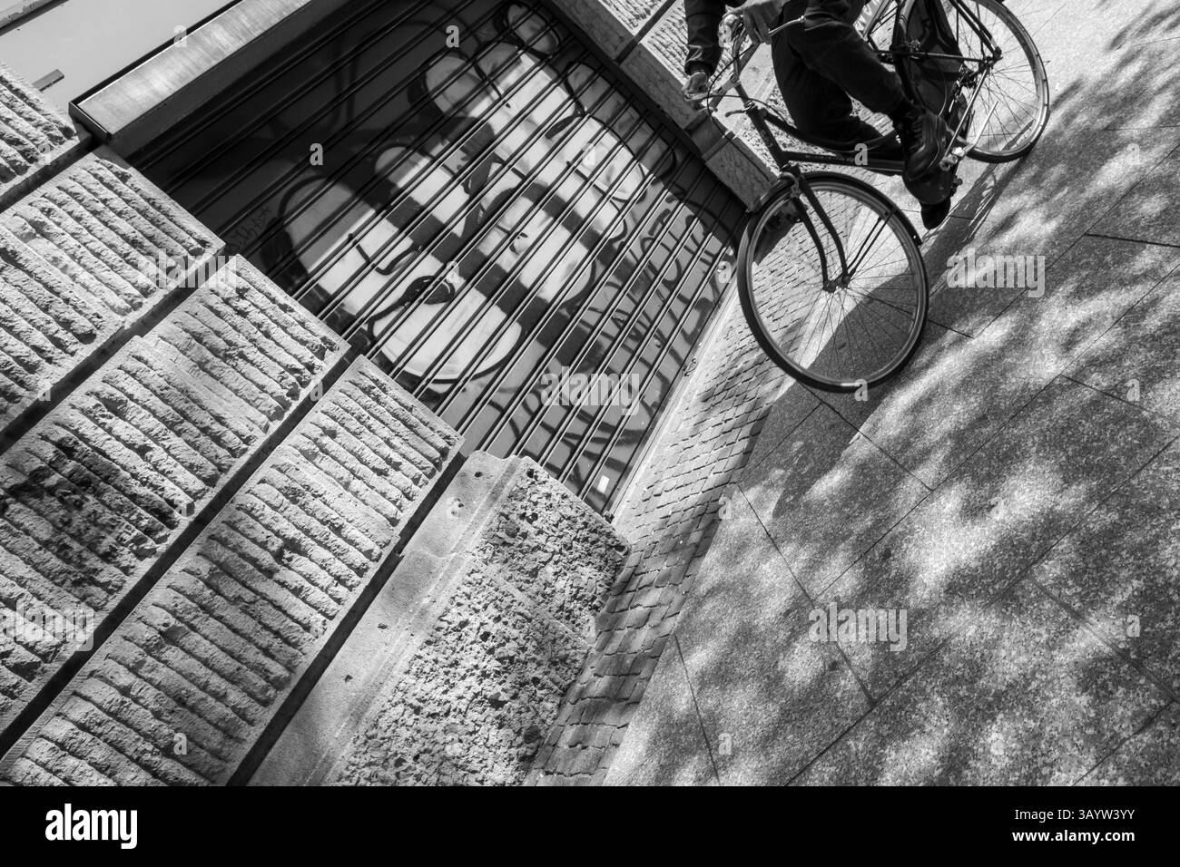 Cycling an old fashioned bicycle on the pavement milan hi-res stock ...
