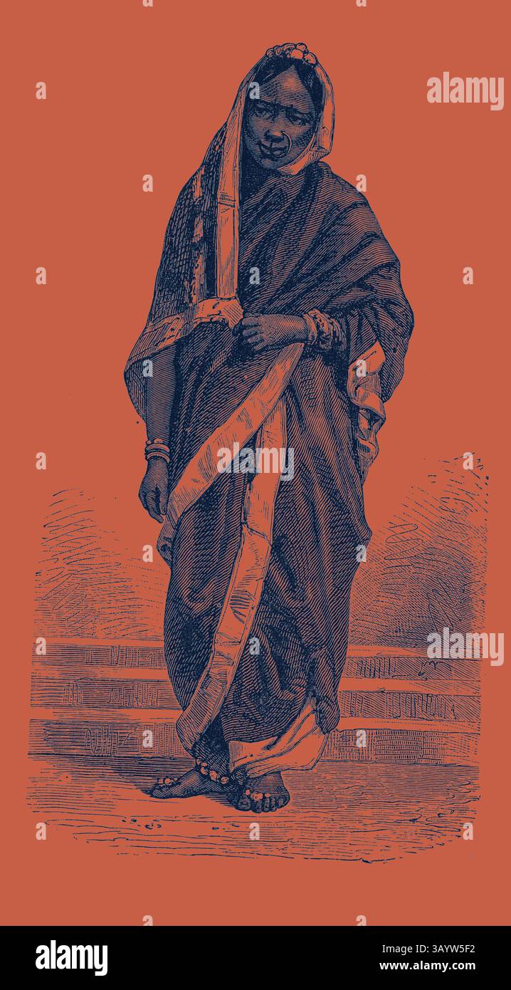 A woman draped in traditional attire stands confidently, adorned with ...