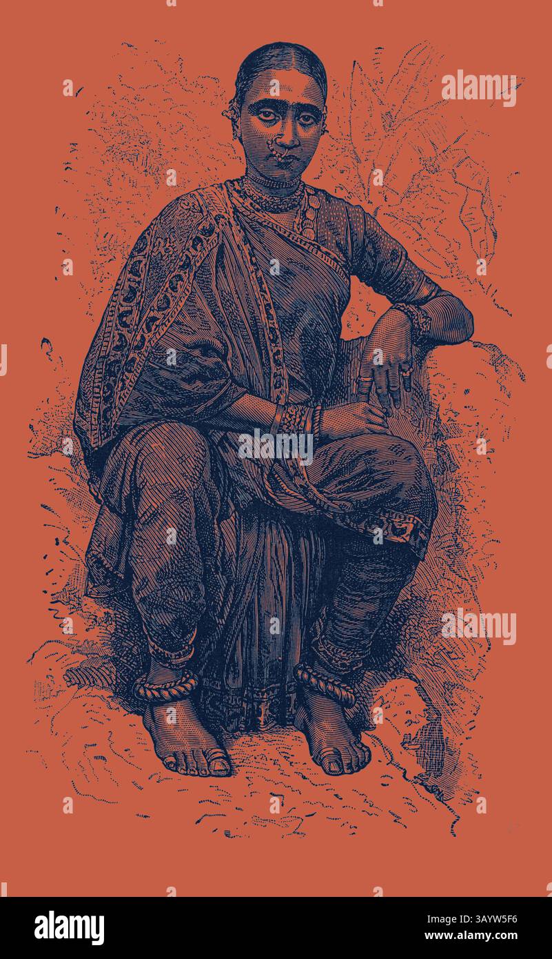 A woman sits gracefully, adorned in traditional attire, with intricate ...
