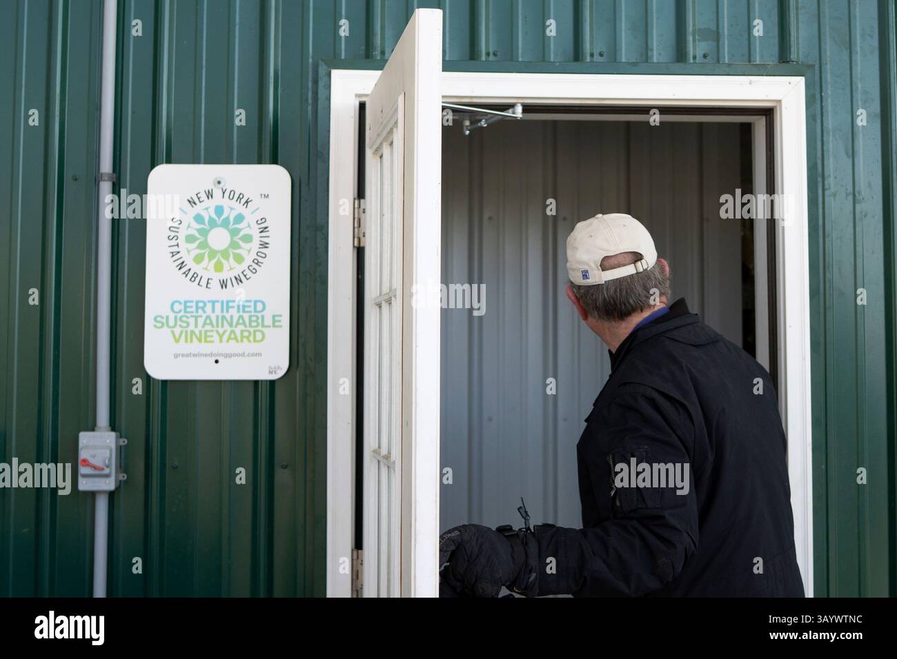 Scott Osborn, owner of Fox Run Vineyards, enters a wine production building Friday, March 21 ...