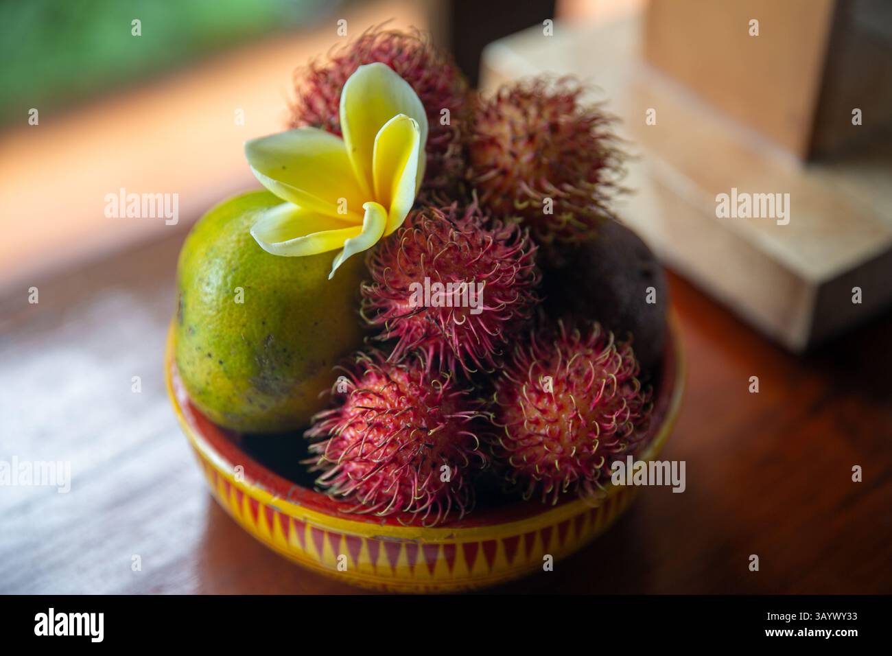 Welcome tropical fruit basket for guests Stock Photo - Alamy