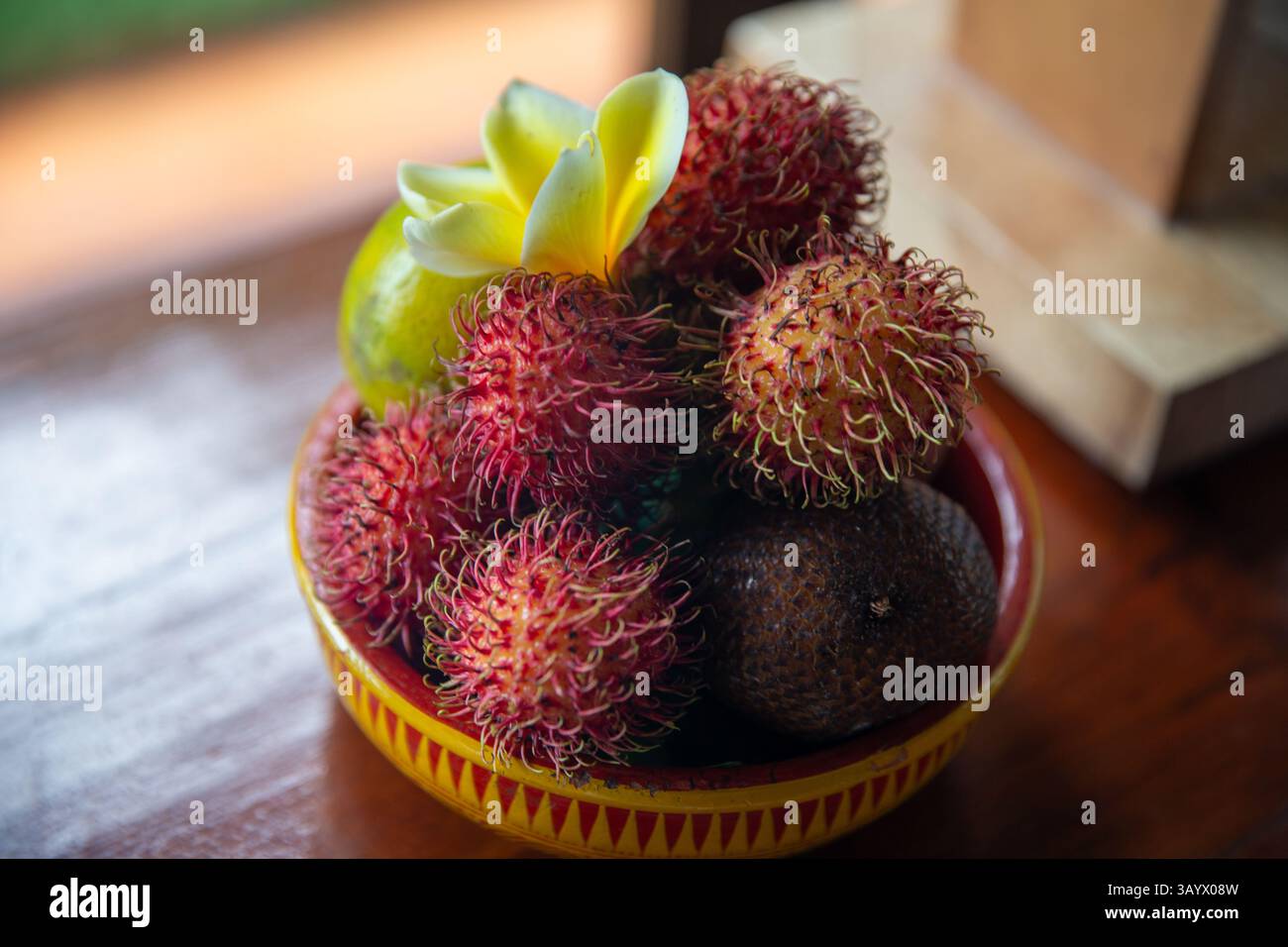 Welcome tropical fruit basket for guests Stock Photo - Alamy