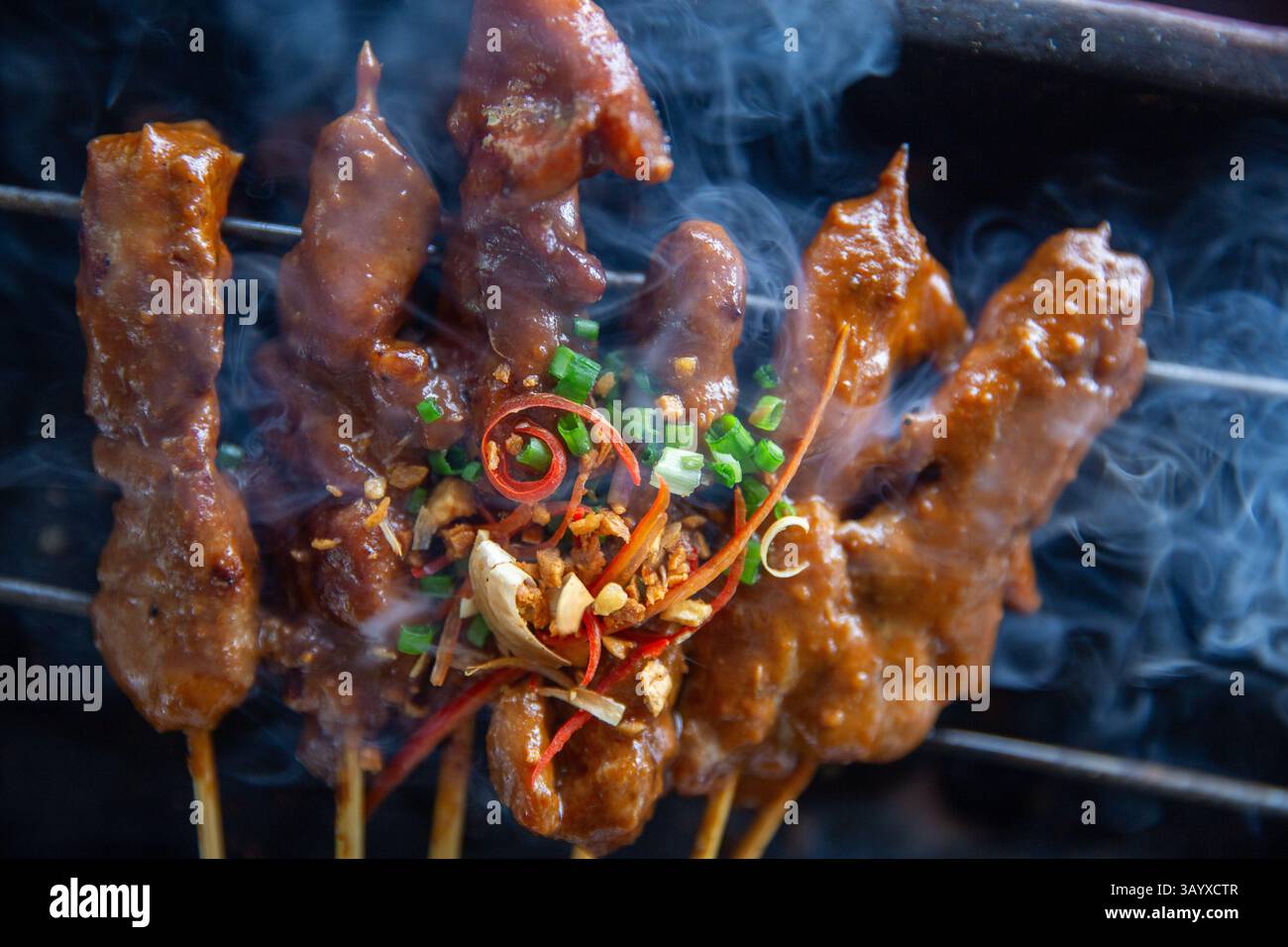 Indonesian Satay being served on a mini grill Stock Photo - Alamy