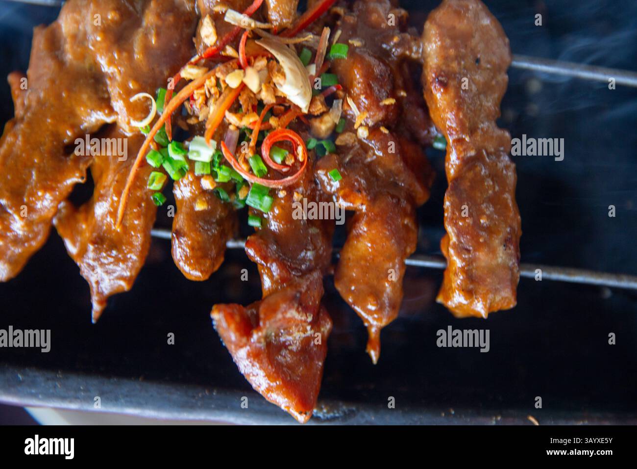 Indonesian Satay being served on a mini grill Stock Photo - Alamy
