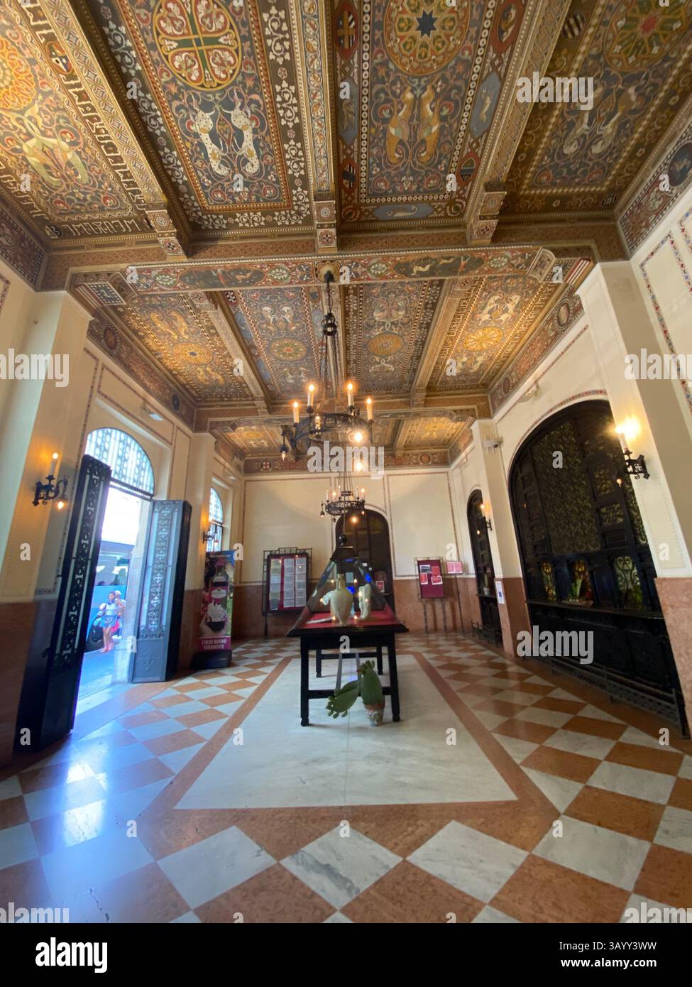 Ornate medieval ceiling and patterned tile floor adorning interior ...