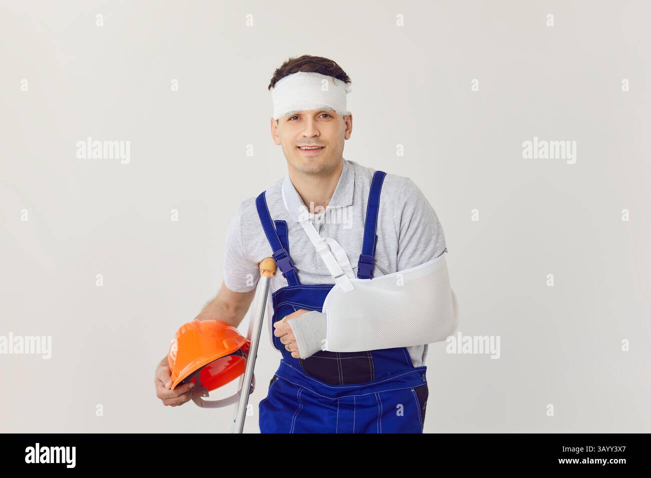 Portrait Of Injured Worker Standing With Crutches And Bandaged Head ...
