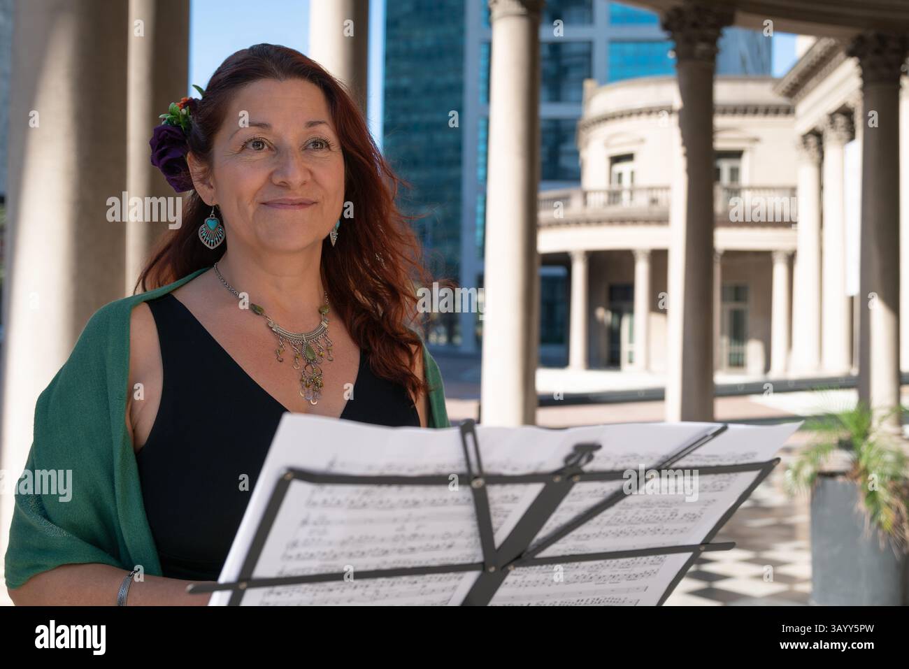 Mature female opera singer in front of a lectern, posing proudly Stock ...
