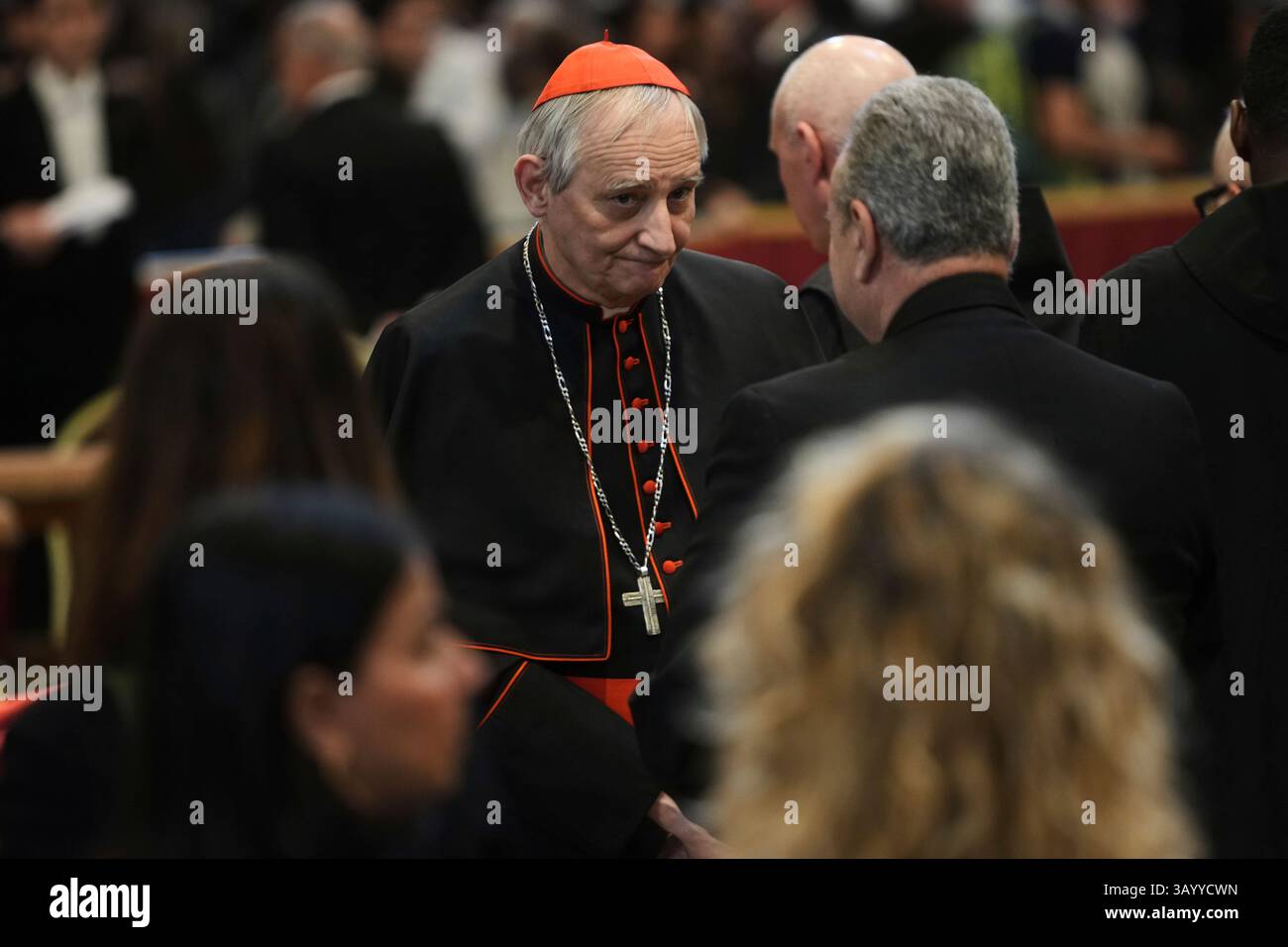 Cardinal Matteo Maria Zuppi looks on as faithful pay their respects to ...