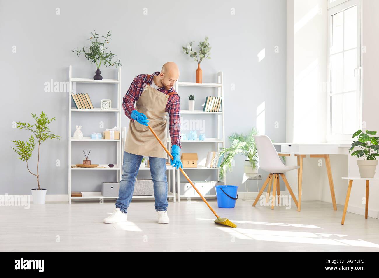 Workman sweeping broom hi-res stock photography and images - Alamy