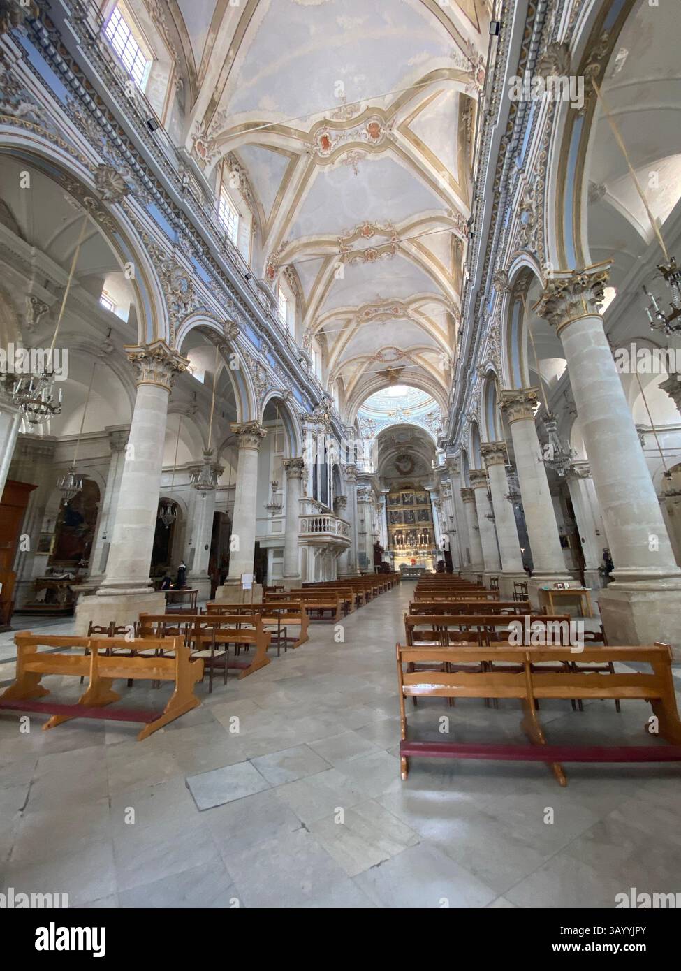 Ornate ceiling and marble columns filling expansive interior of San ...