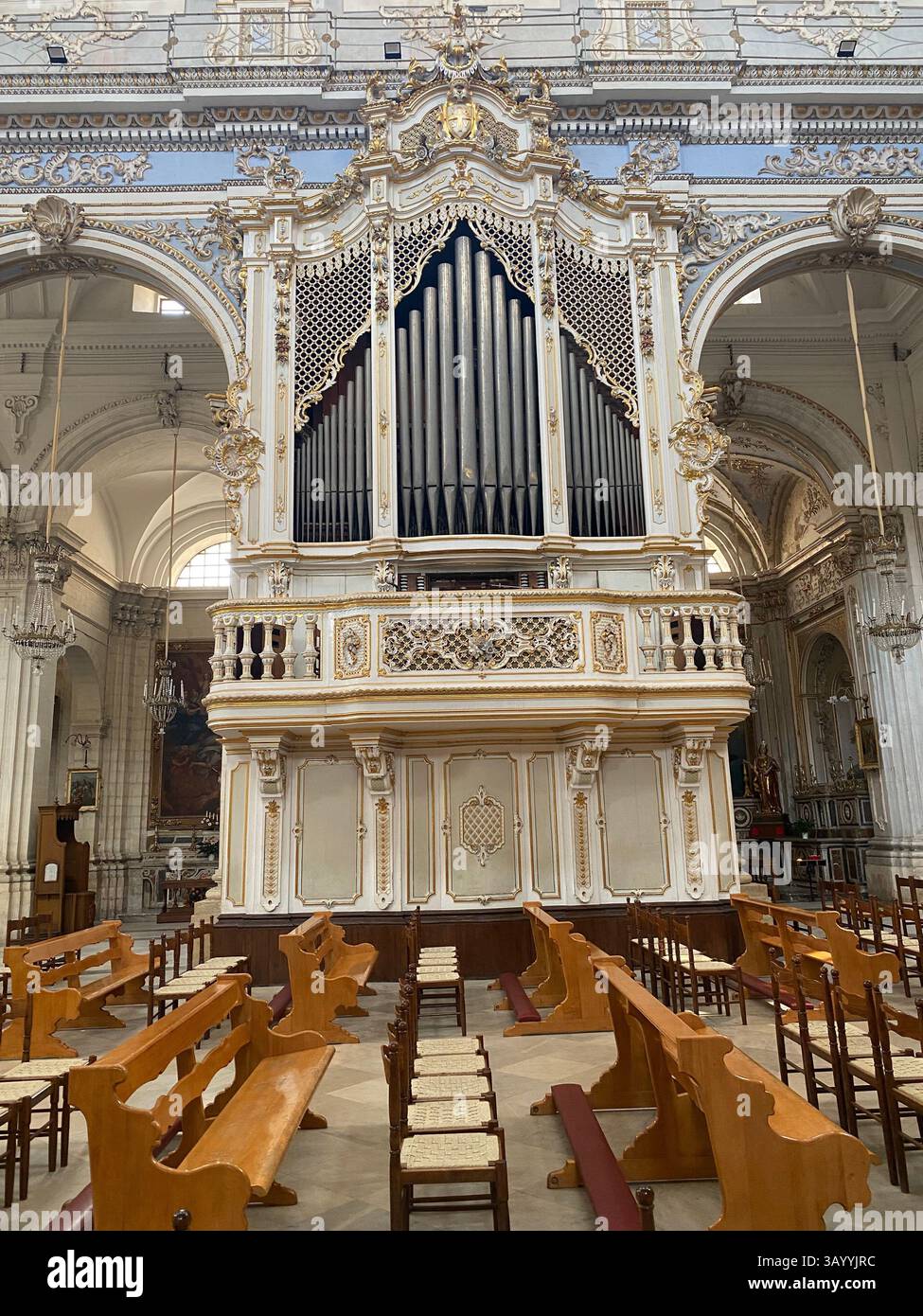 Grand pipe organ illuminating ornate baroque interior of San Giorgio ...