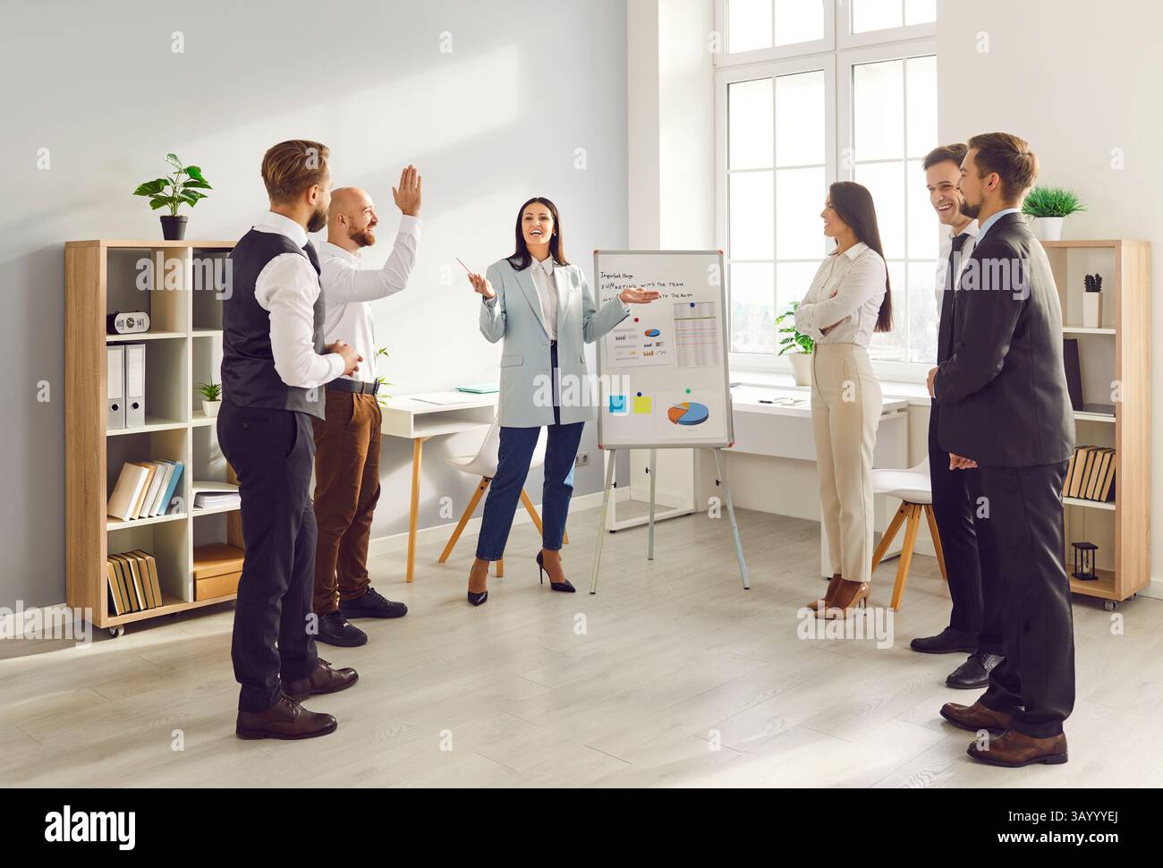 Businesswoman leads presentation for office workers power of teamwork ...