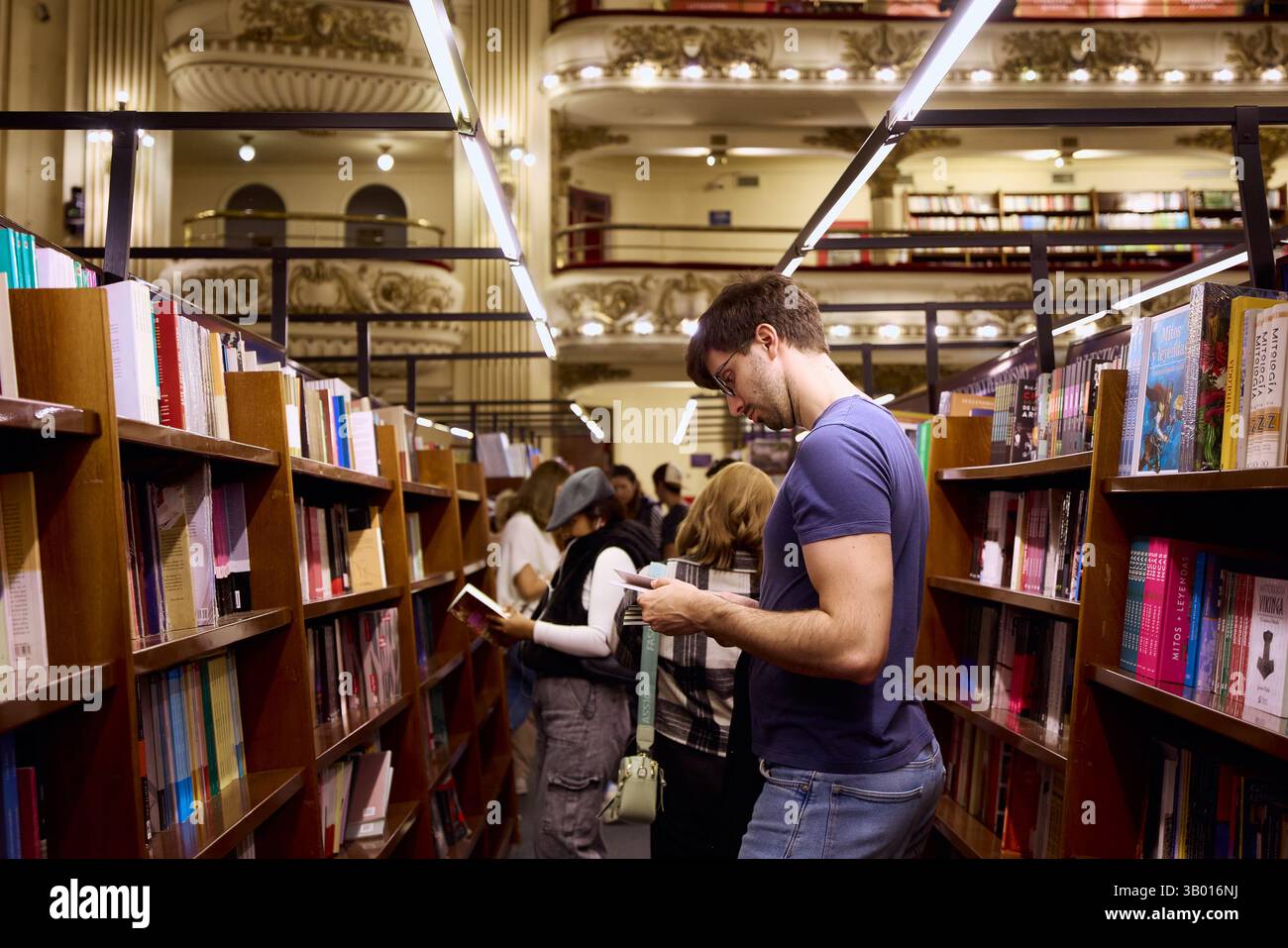Buenos Aires, Argentina. 21st Apr, 2025. Readers are seen at Librer¨ªa El Ateneo in Buenos Aires ...