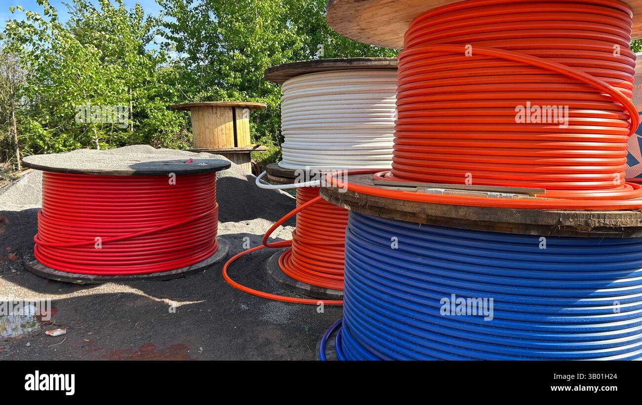 various fiber optic cables on the street Stock Photo - Alamy