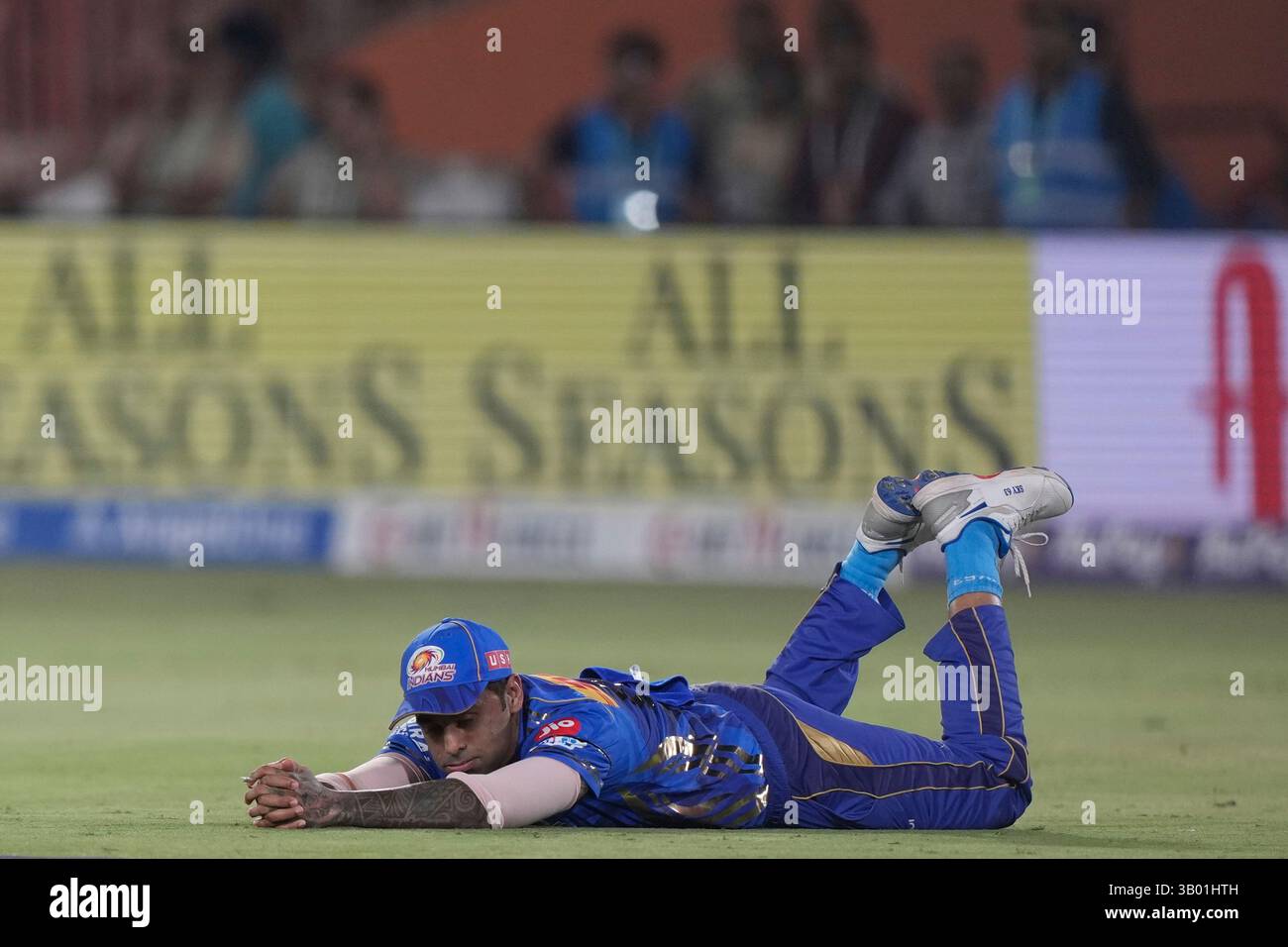 Mumbai Indians' Suryakumar Yadav dives to field the ball during the Indian Premier League ...