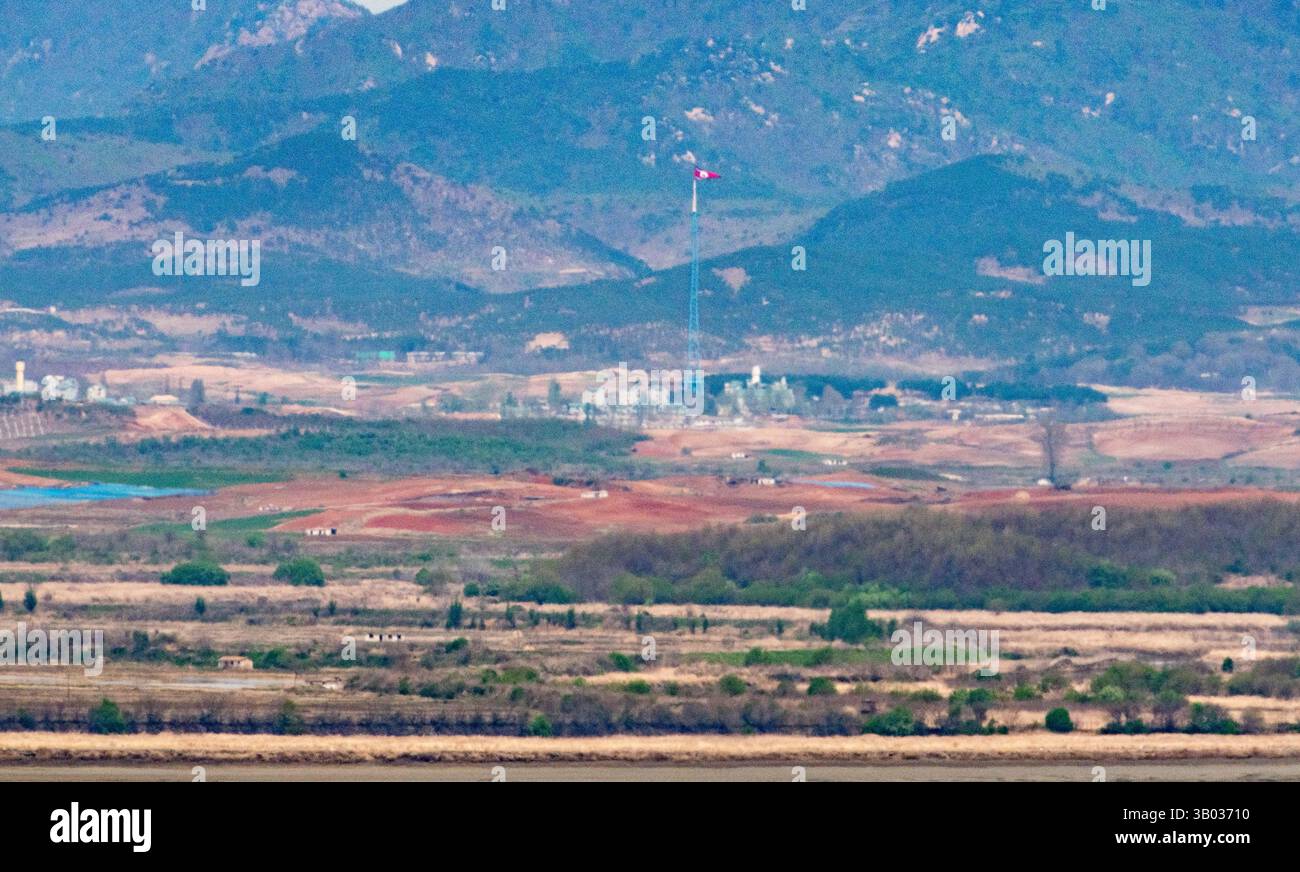 A North Korean flag flutters in the wind atop a 160-meter tower in the ...