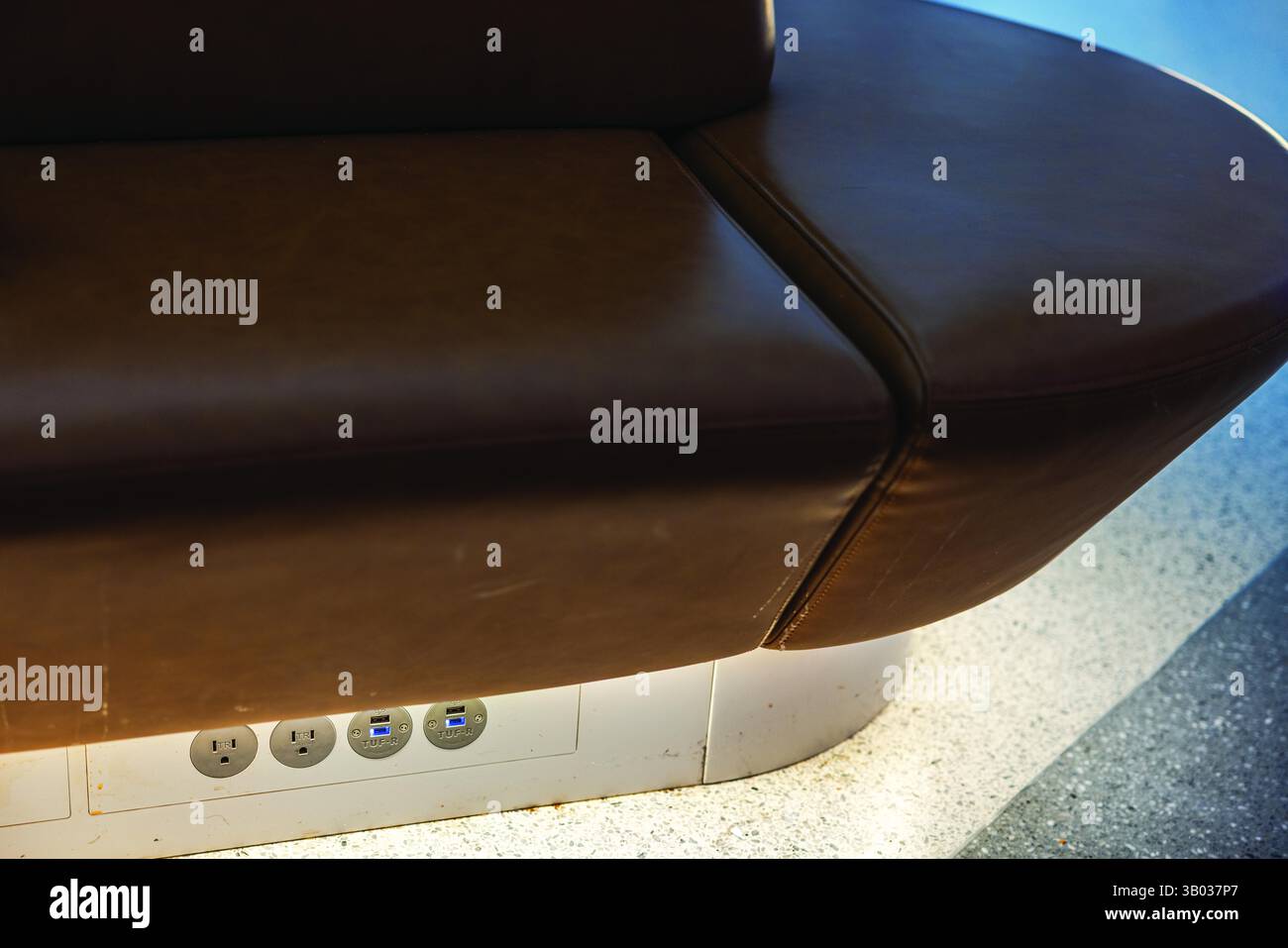 Modern brown bench with built-in electrical outlets and USB charging ...