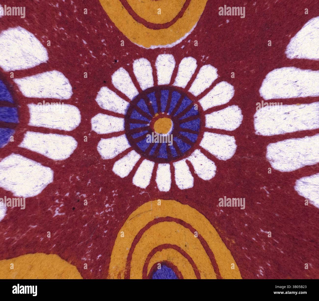 A vibrant pattern featuring alternating flowers with circular designs ...