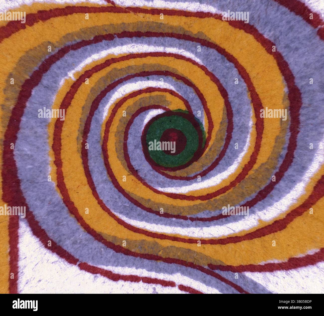 A swirling pattern features vibrant colors spiraling inward, creating a ...