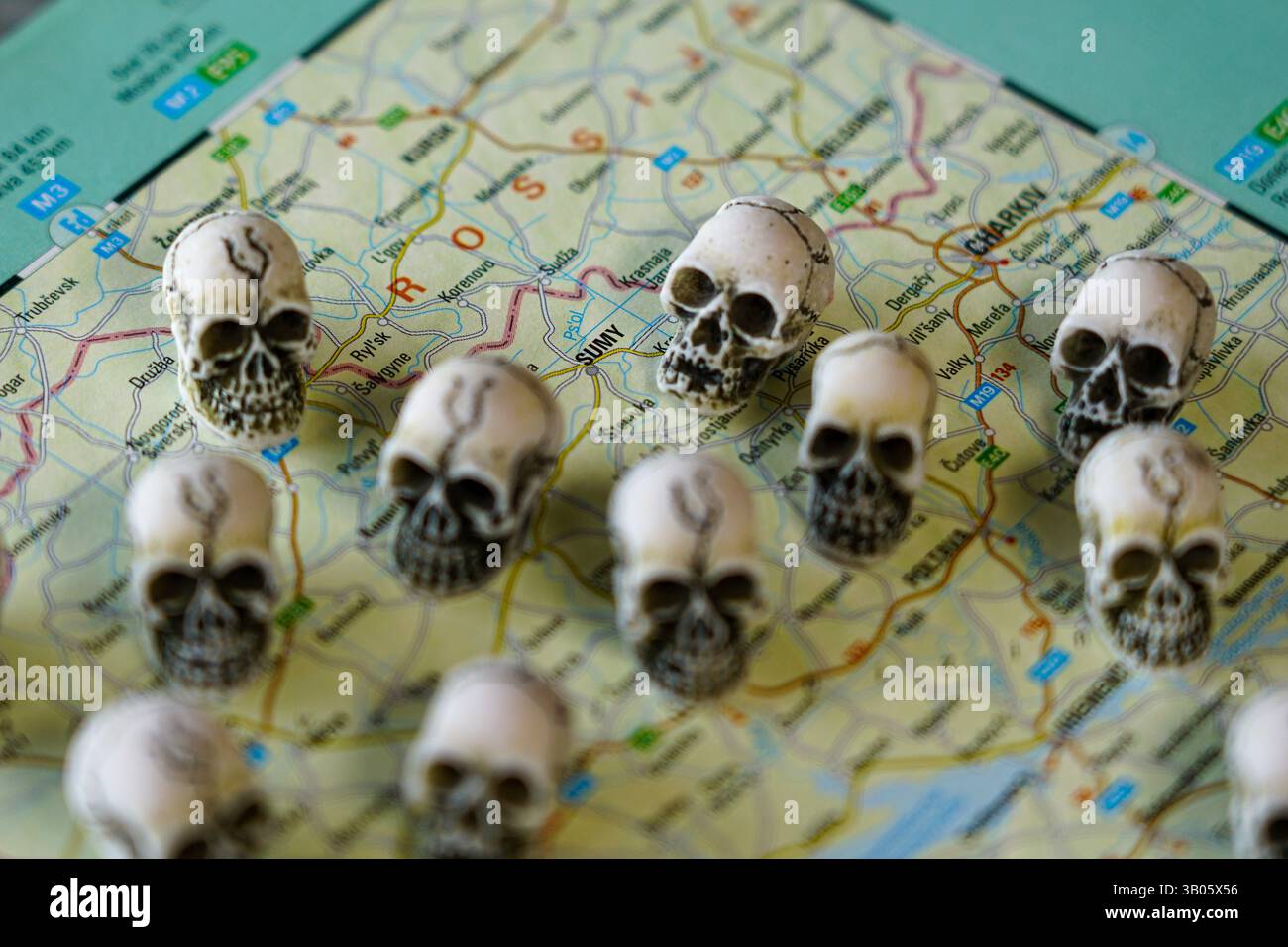 Many skulls on a map of Ukraine near the inscription Sumy, Kharkov, a ...