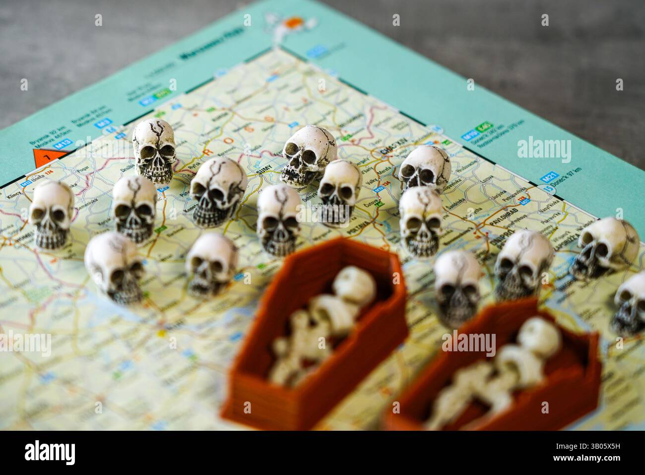 Many skulls and skeletons in coffins on a map of Ukraine near the ...