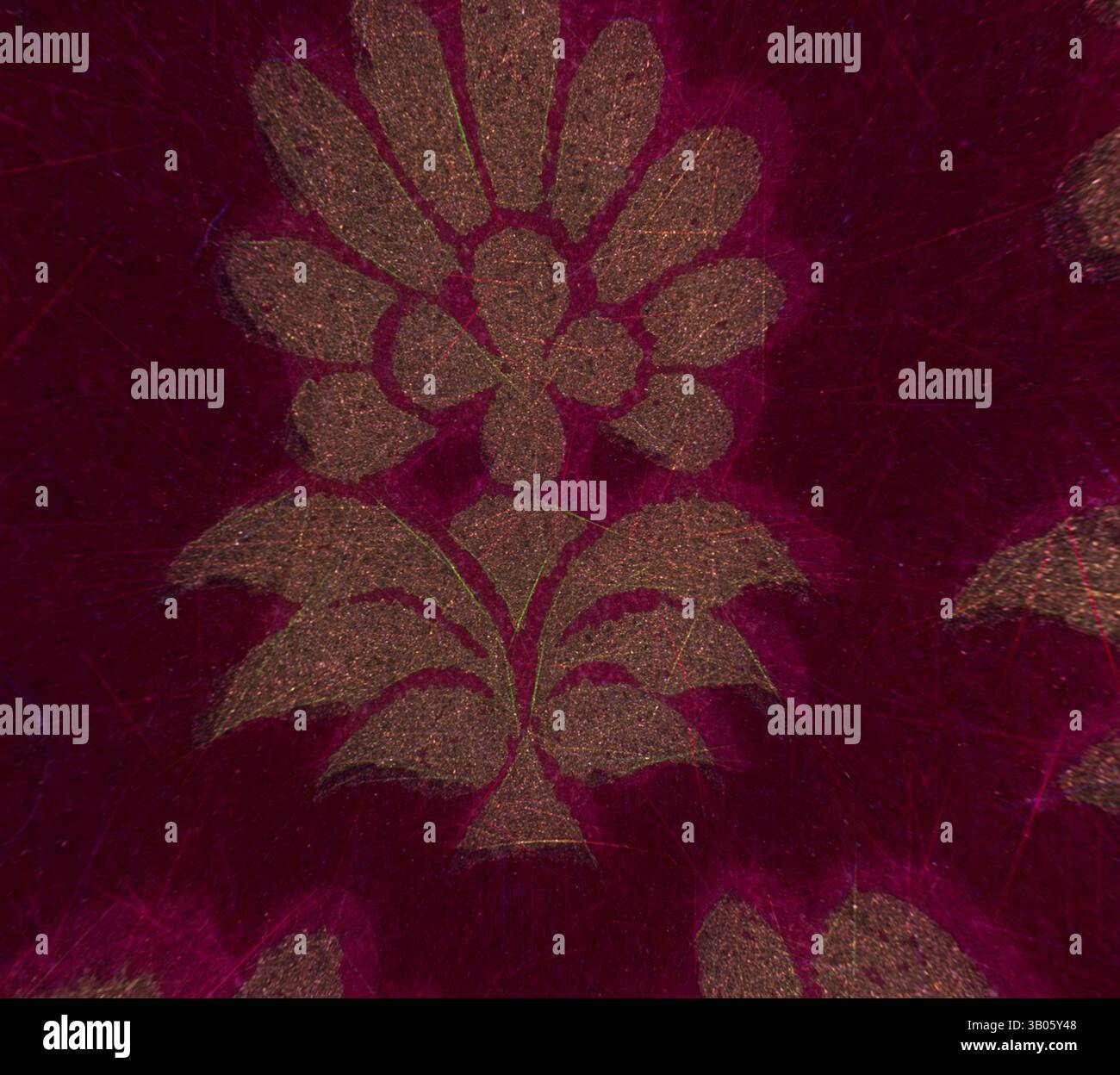 A detailed pattern featuring stylized floral designs in rich hues ...