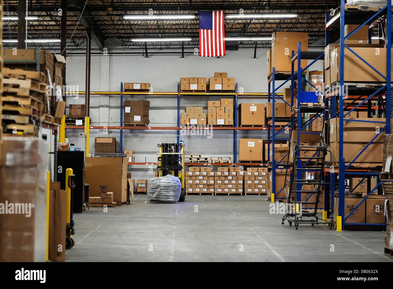 An American flag is seen inside the Marlin Steel Wire manufacturing ...