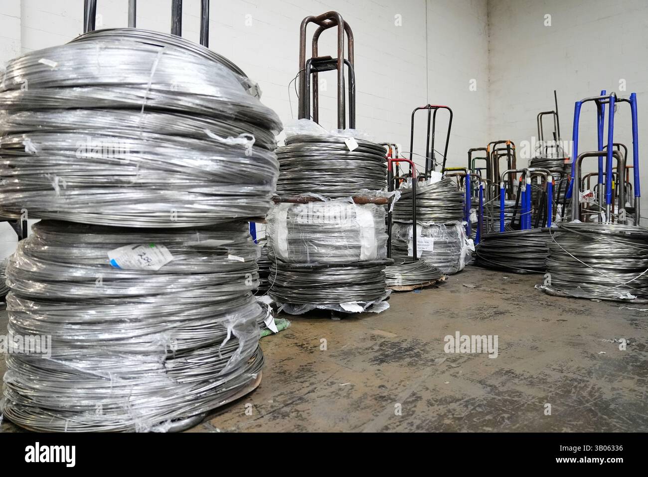 Coils of steel wire are seen at the Marlin Steel Wire manufacturing ...