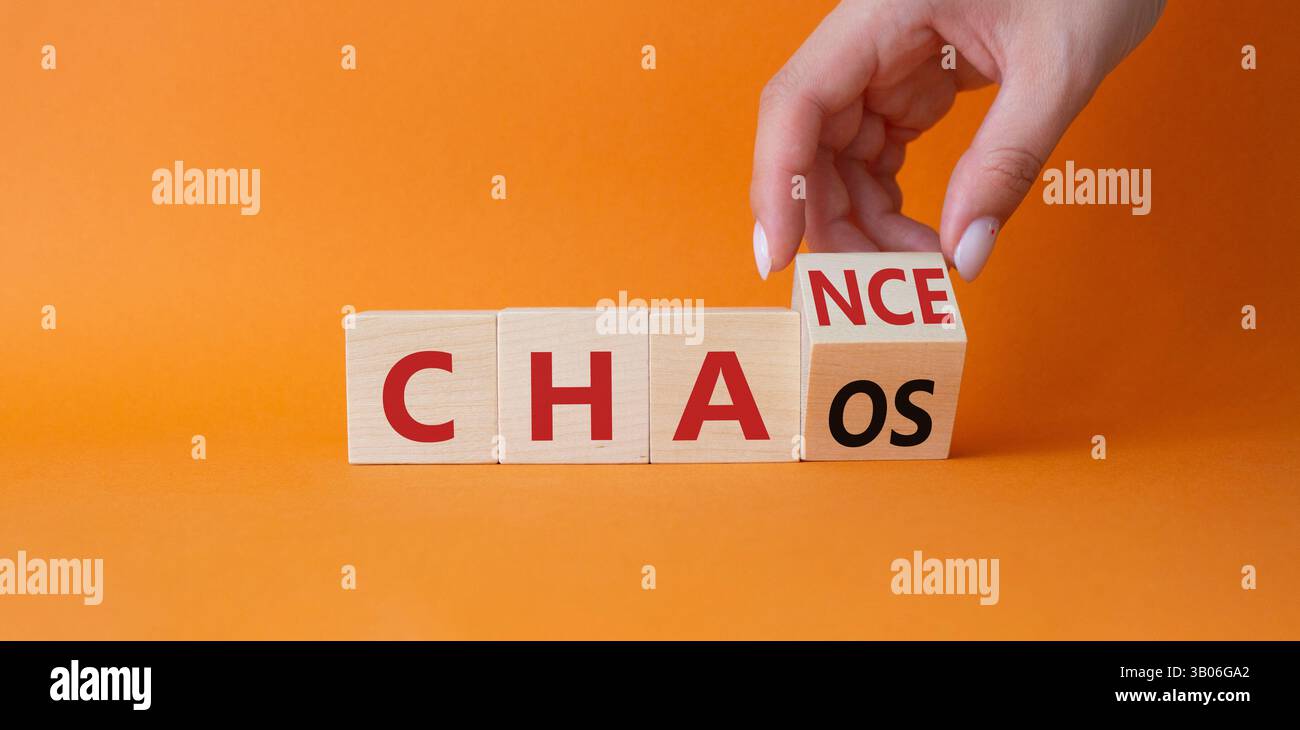 Chance vs Chaos symbol. Businessman hand Turnes cube and changes word ...