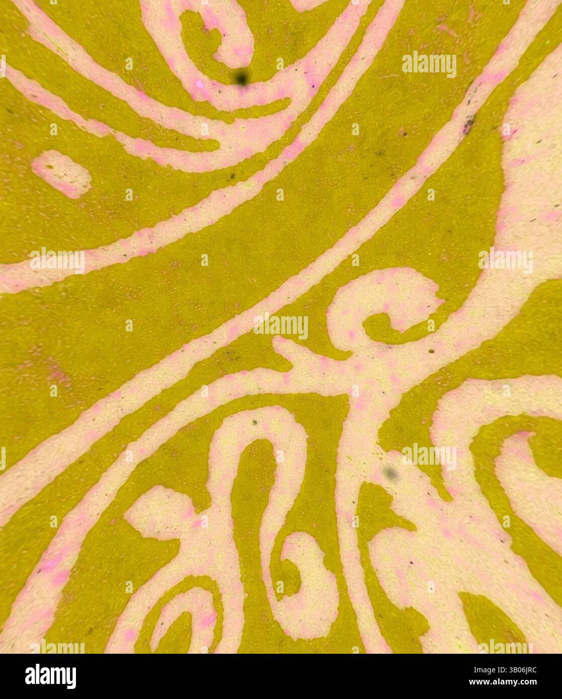A close-up view of intricate swirling patterns in vibrant yellow and ...