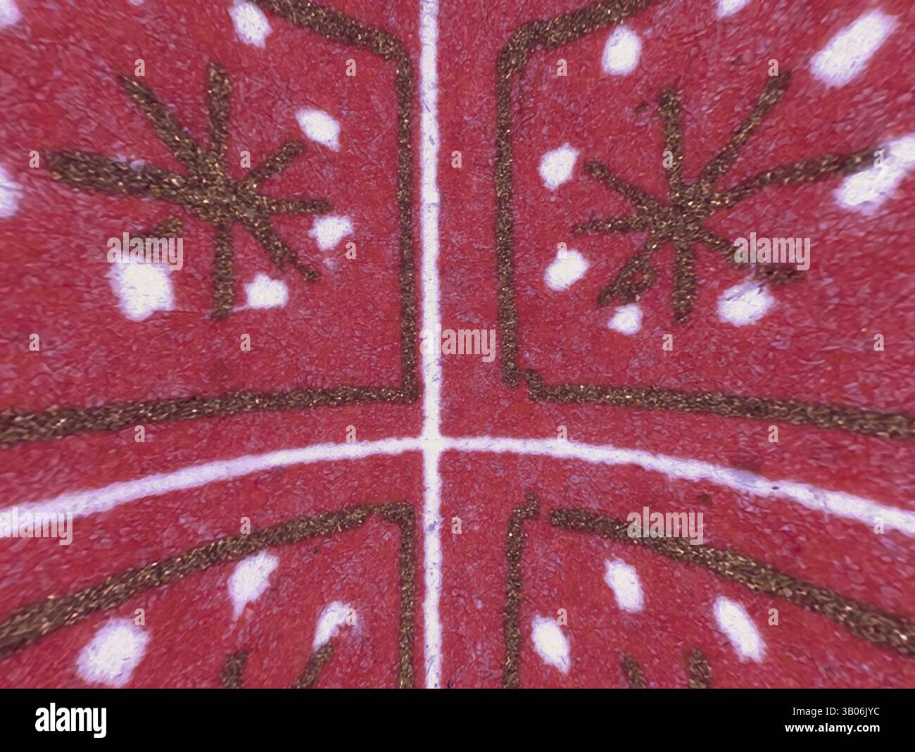 A close-up view of intricate patterns featuring vibrant red and white ...