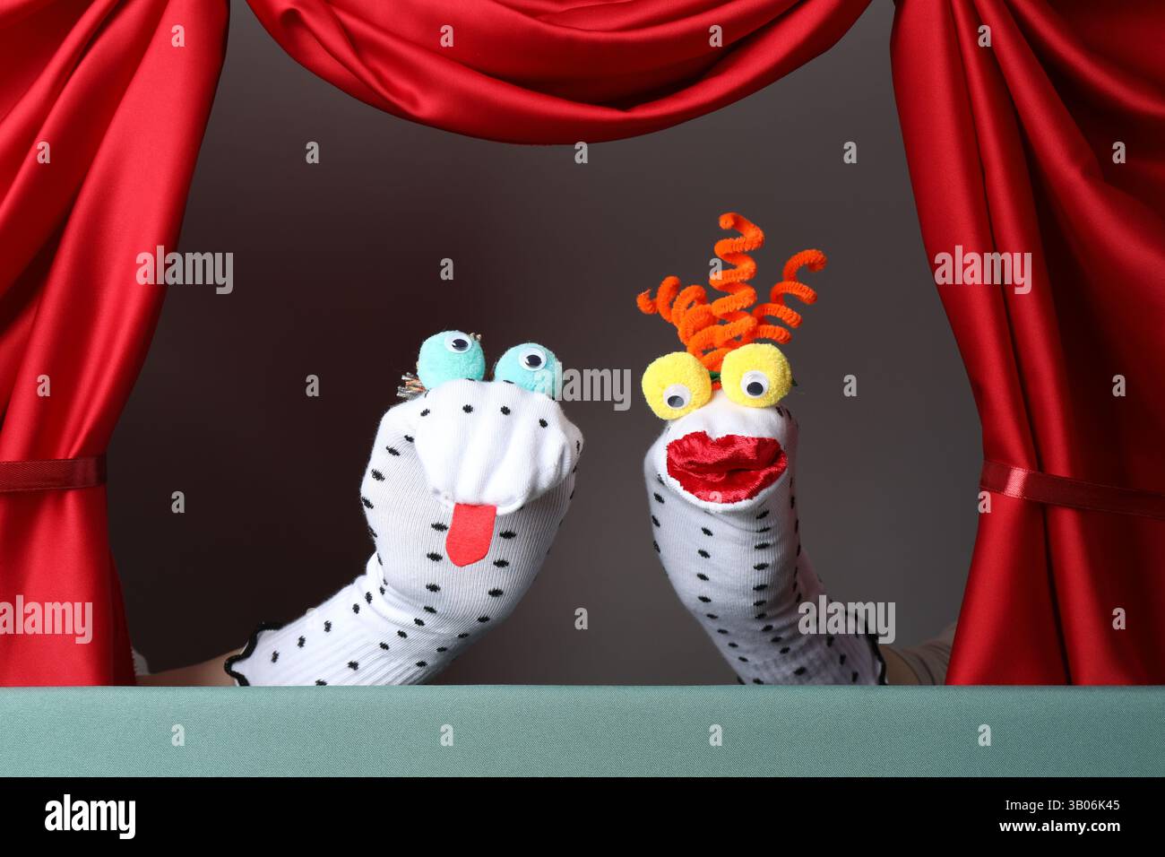 Creative puppet show on stage with red curtains Stock Photo - Alamy