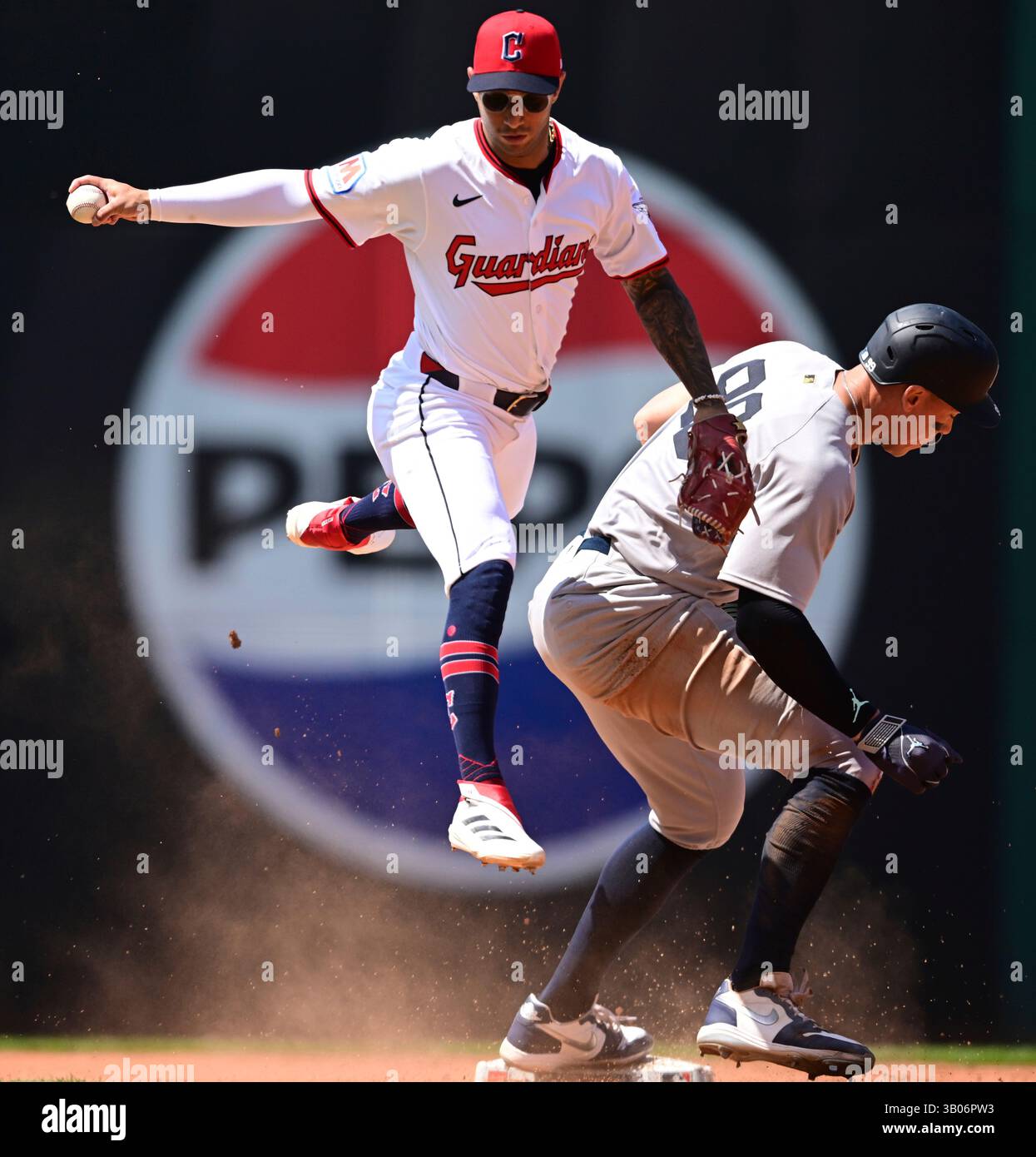 Cleveland Guardians shortstop Brayan Rocchio attempts to avoid New York ...