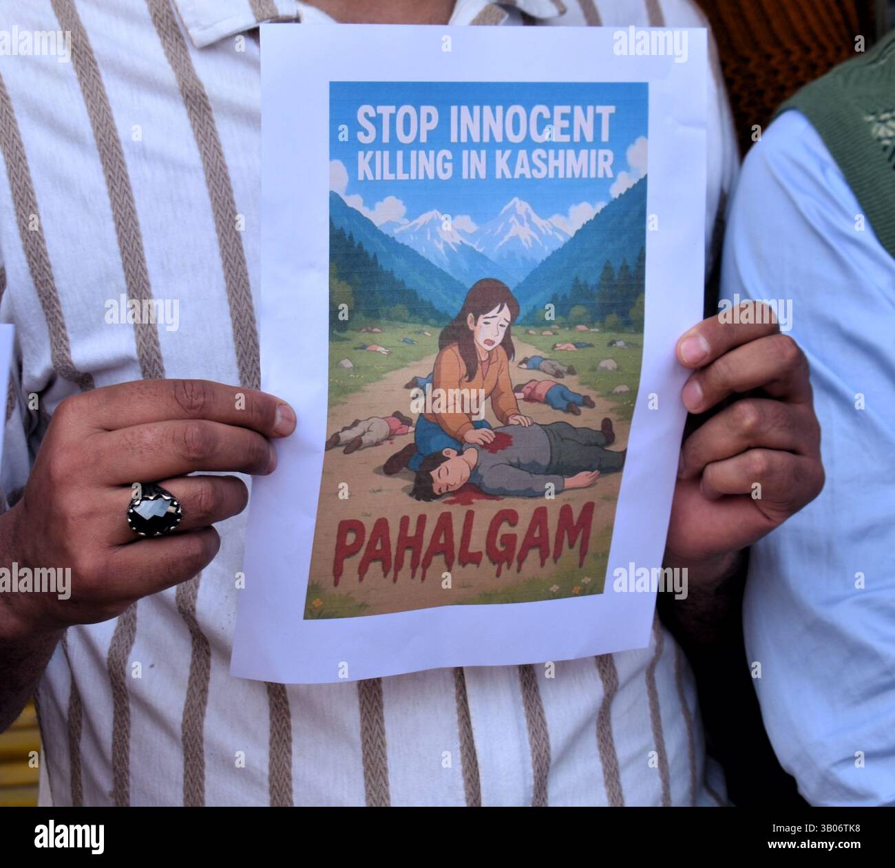 Sopore, India. 23rd Apr, 2025. People taking part during a protest ...
