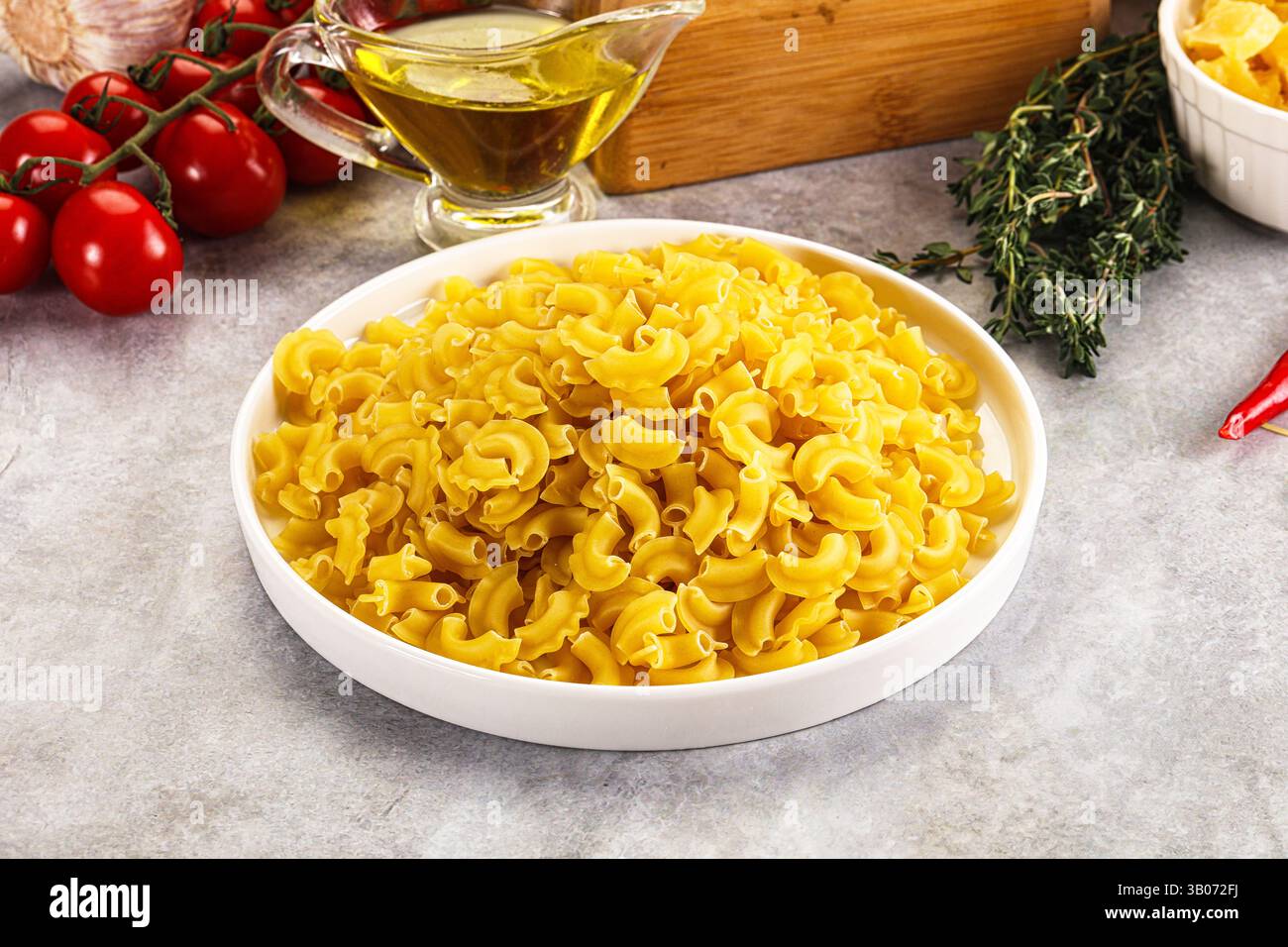 Raw dry Italian pasta Gallo for cooking Stock Photo - Alamy