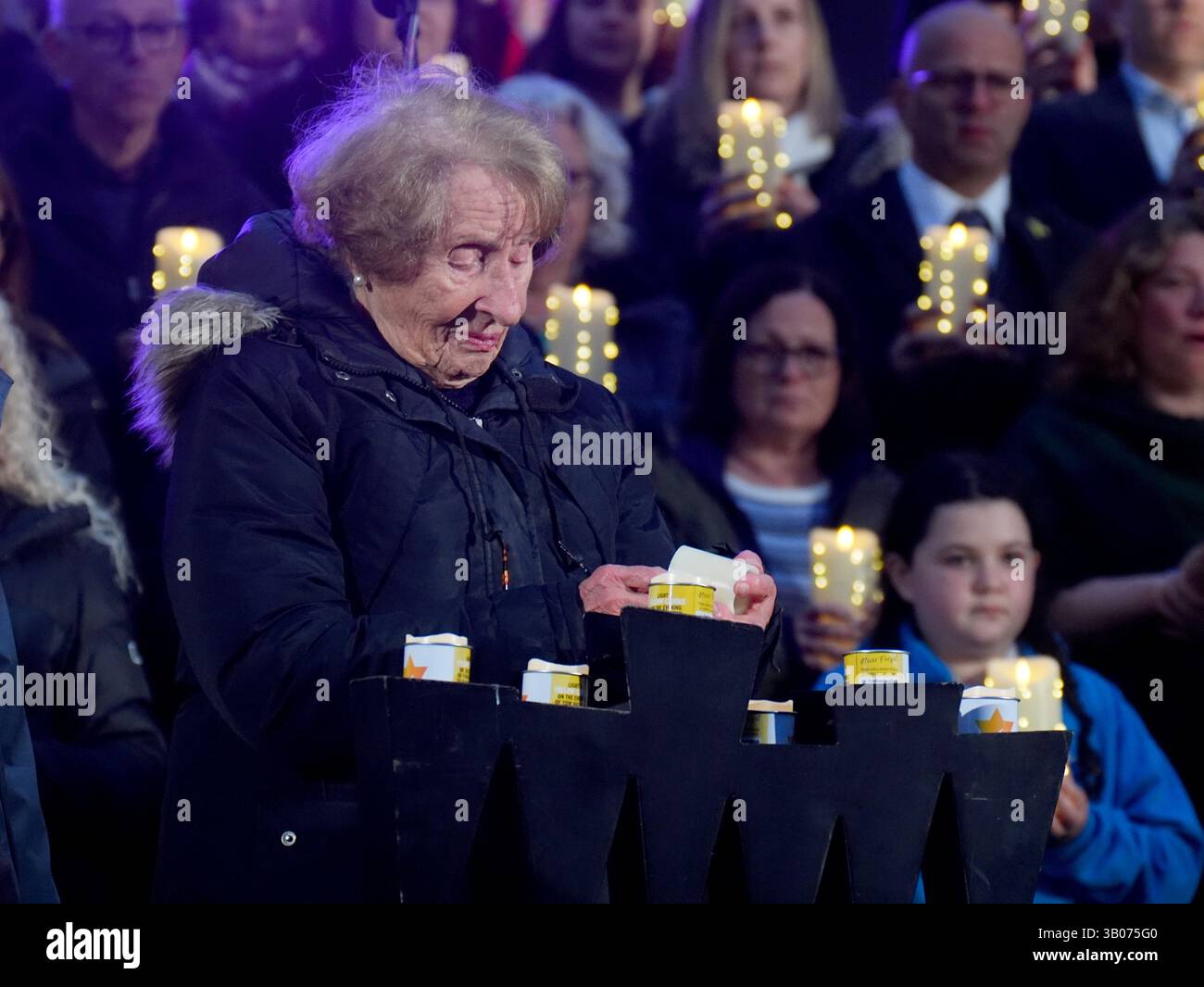 Bergen-Belsen survivor Susan Pollack lights a candle at the 80th ...