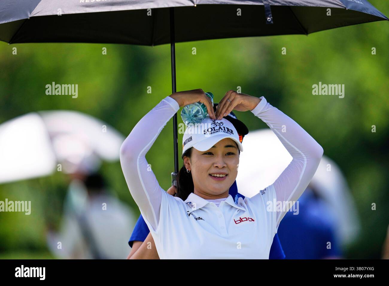 Ina Yoon, of South Korea, gestures as she works on the driving range ...