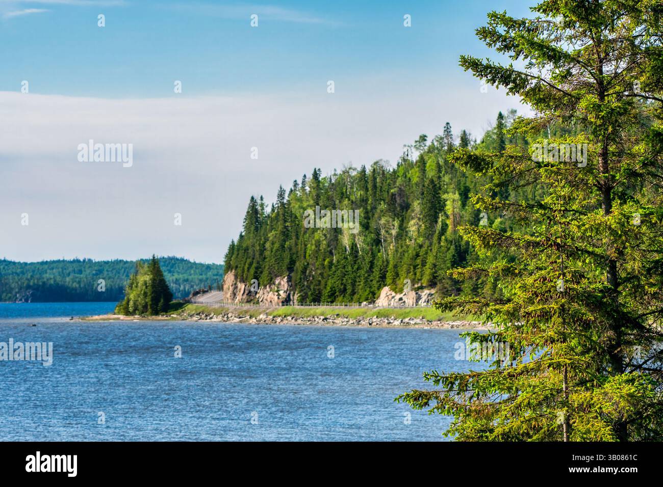 Scenic landscape of Lake Helon, including rock cliff, lush landscapes ...