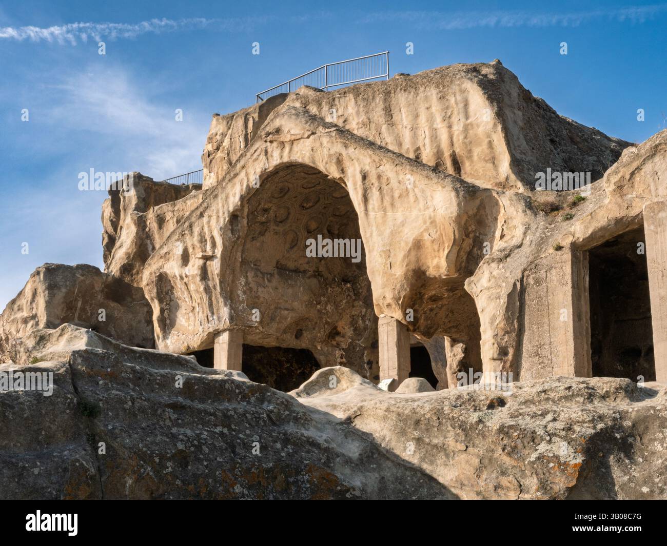 Historical cave complex carved into rocky terrain, revealing ancient ...