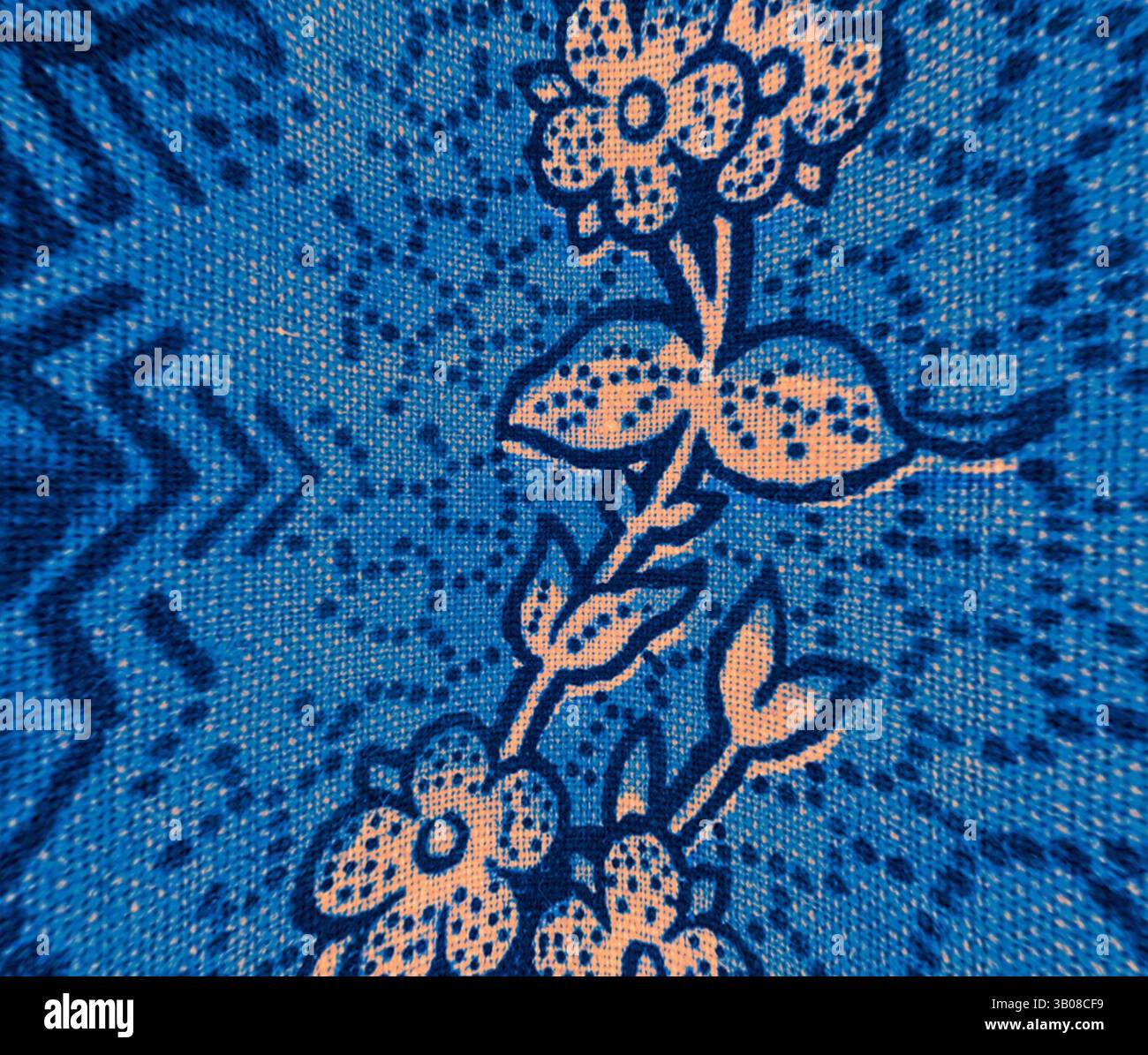 A vibrant textile featuring intricate floral designs and bold blue ...