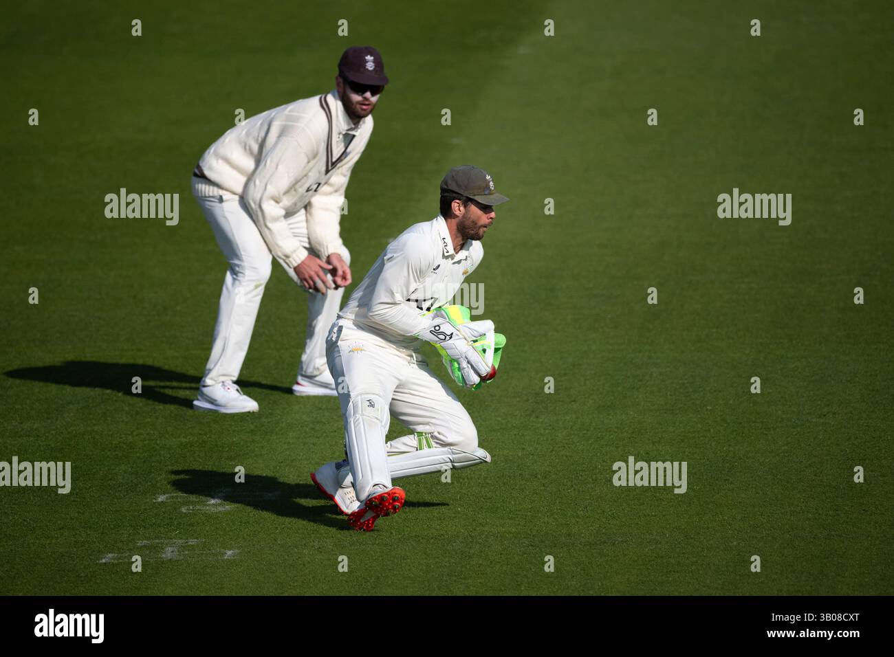 Wicket keeper wearing baseball cap hi-res stock photography and images ...