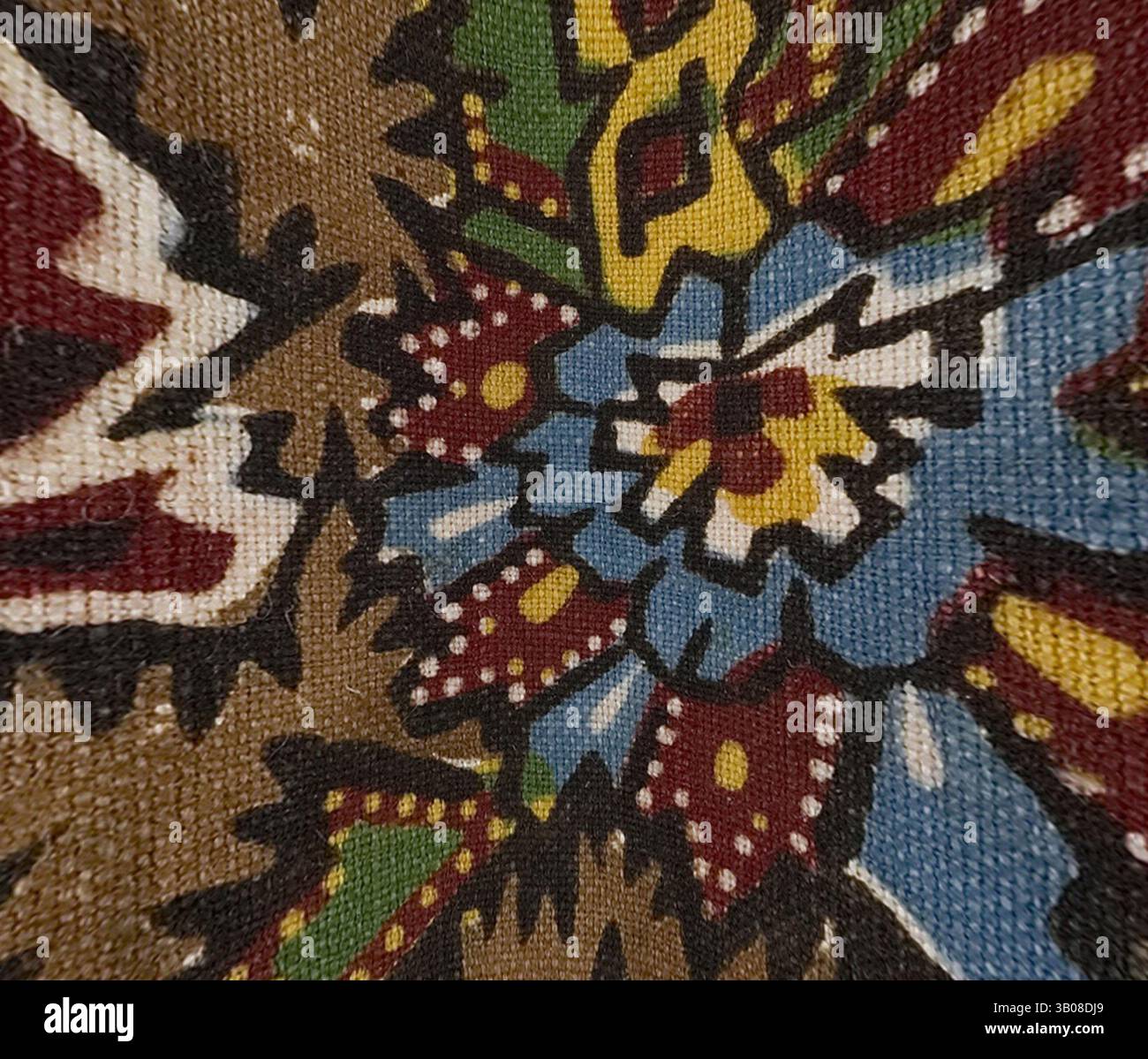A vibrant textile featuring a bold floral pattern with intricate ...