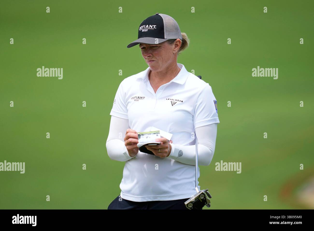 Alena Sharp, of Canada, works on the 18th green during a practice round ...