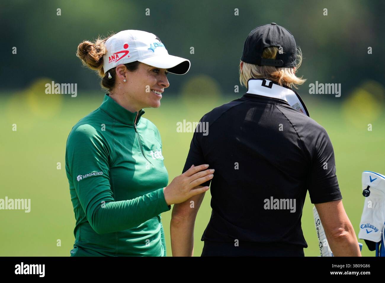 Gaby Lopez, of Mexico, left, and Ryann O'Toole, right, chat as they ...