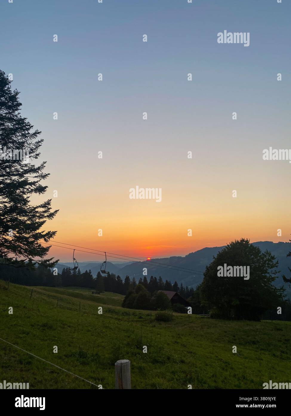 Peaceful Mountain Sunset Landscape with Cable Lift and Alpine Forests ...