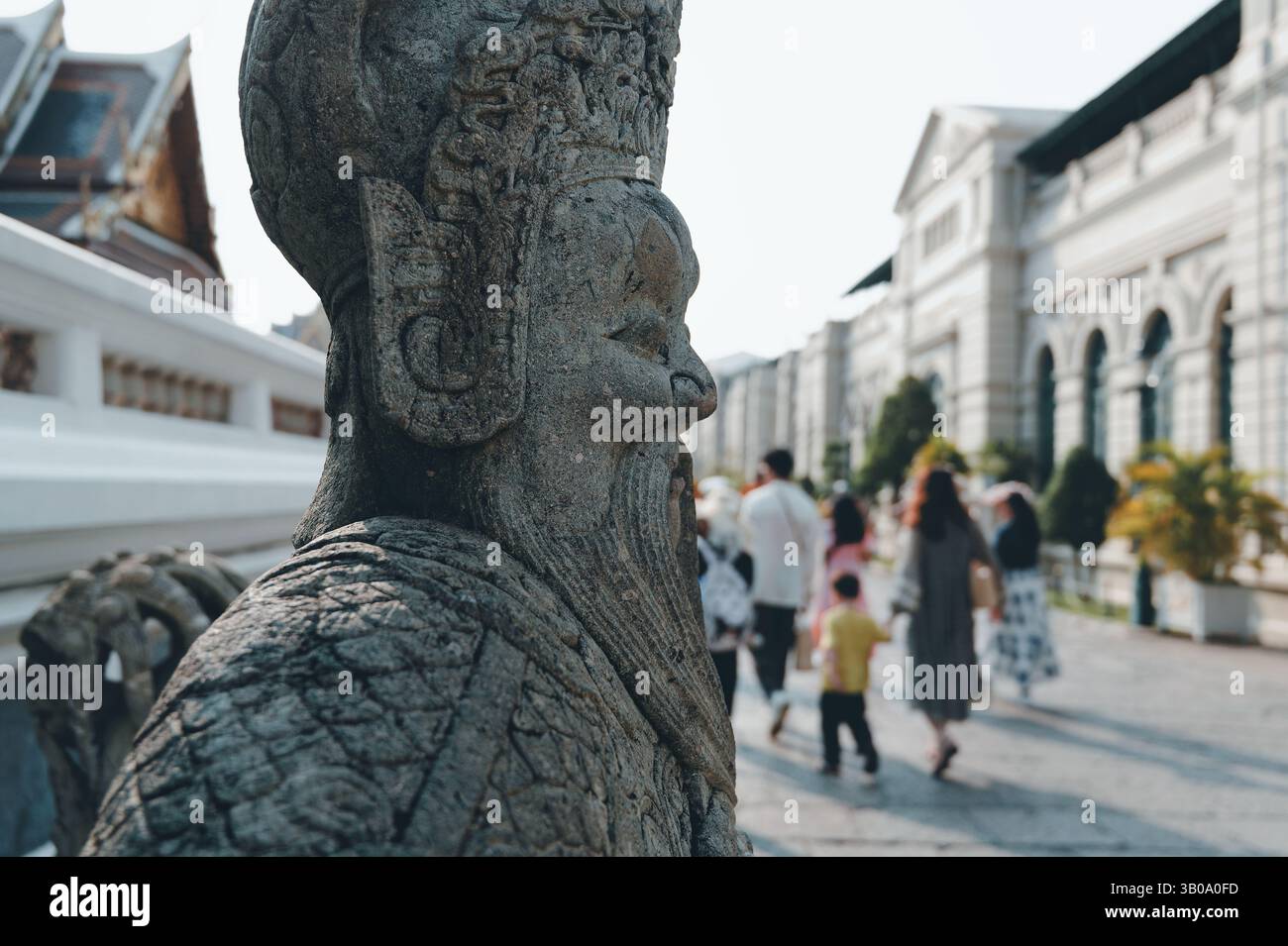 Stone guardian watches silently as visitors flow through the Grand ...