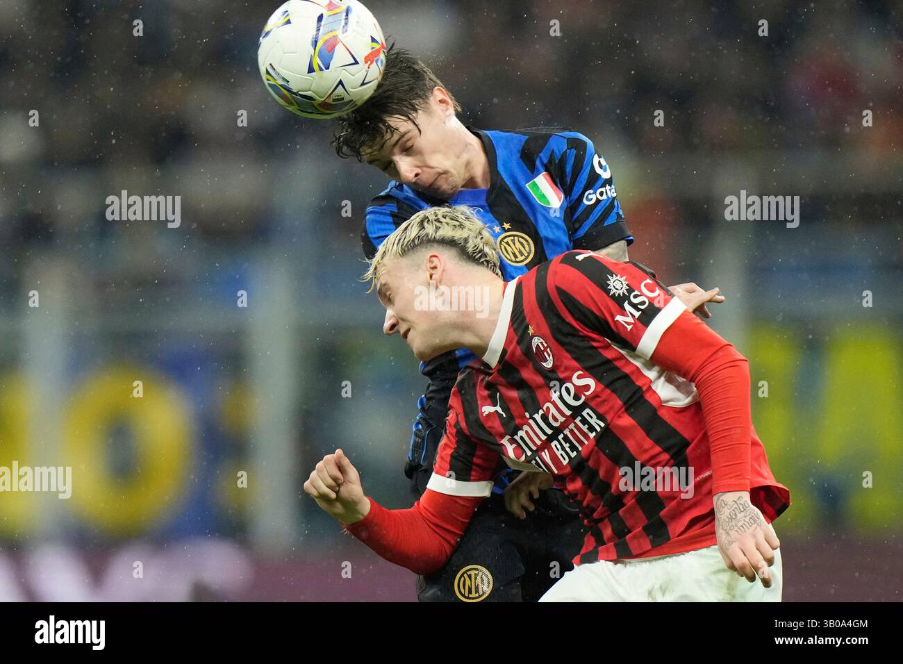 Inter Milan's Nicola Zalewski, top, and AC Milan's Alex Jimenez vie for ...