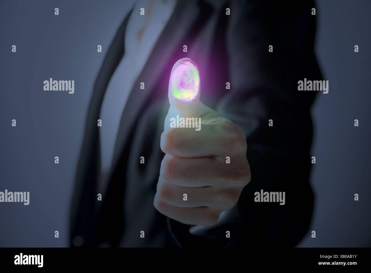 Colorful fingerprint remaining on surface while woman pressing her ...