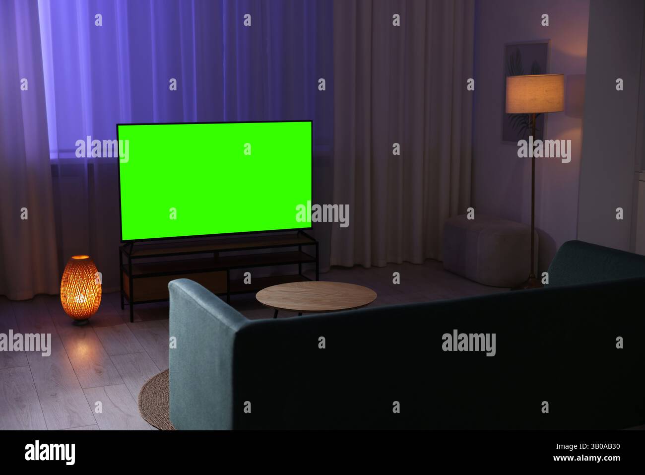 Modern TV set with green screen in living room. Chroma key compositing ...