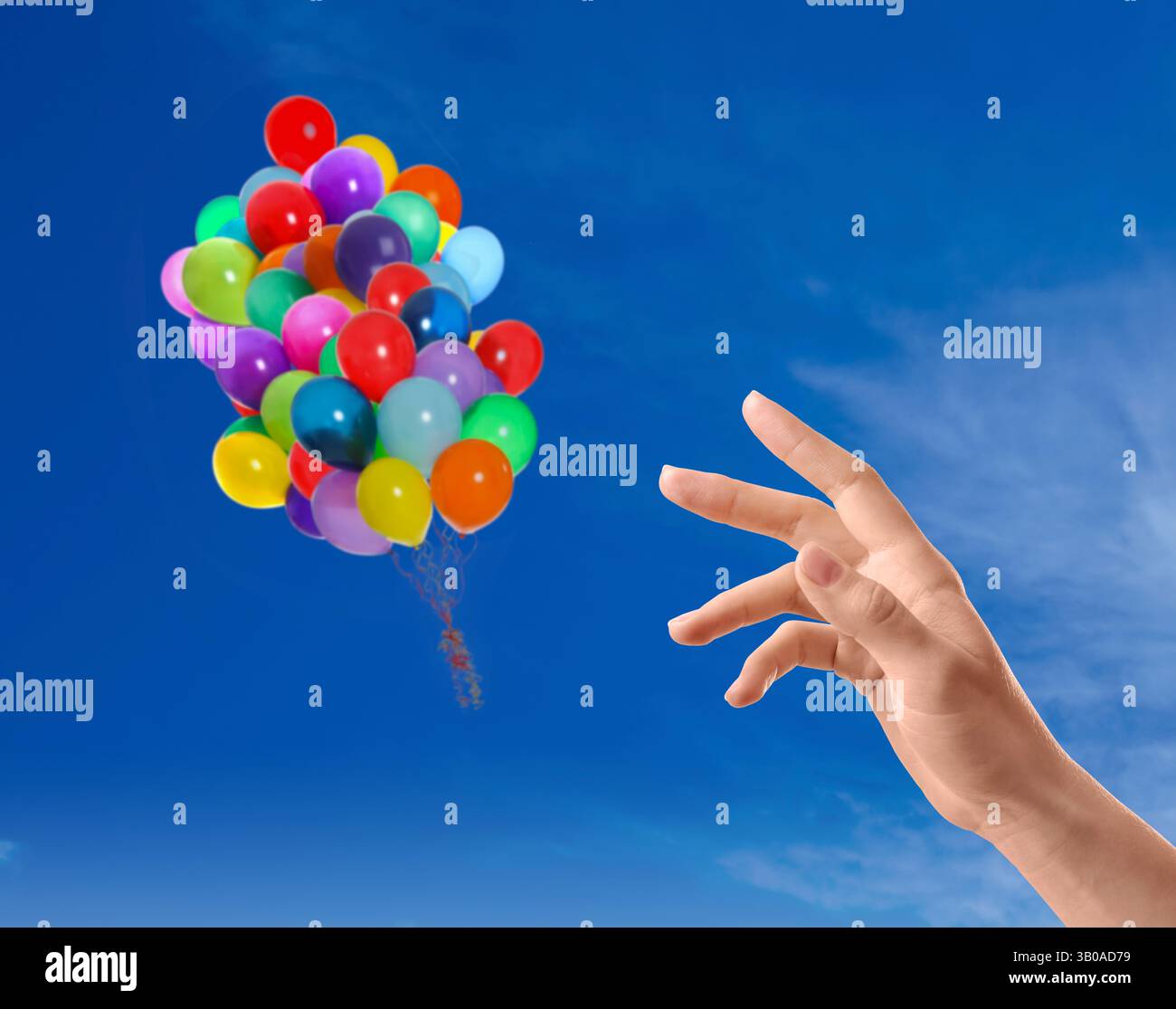 Woman let go bunch of balloons out of her hand into sky, closeup ...